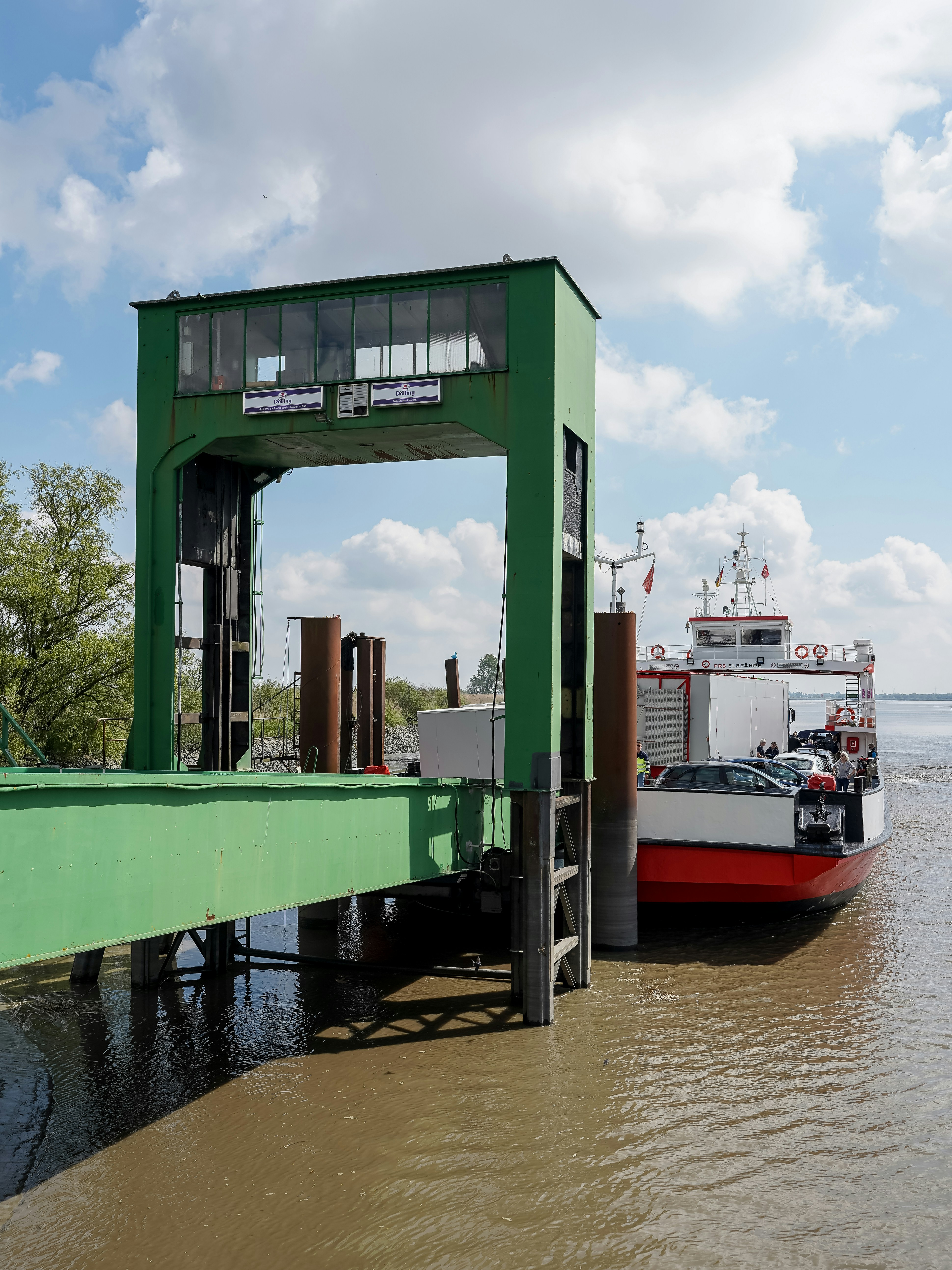 Green Gantry Overwater: A Docking Ferry Under a Pier Gate
