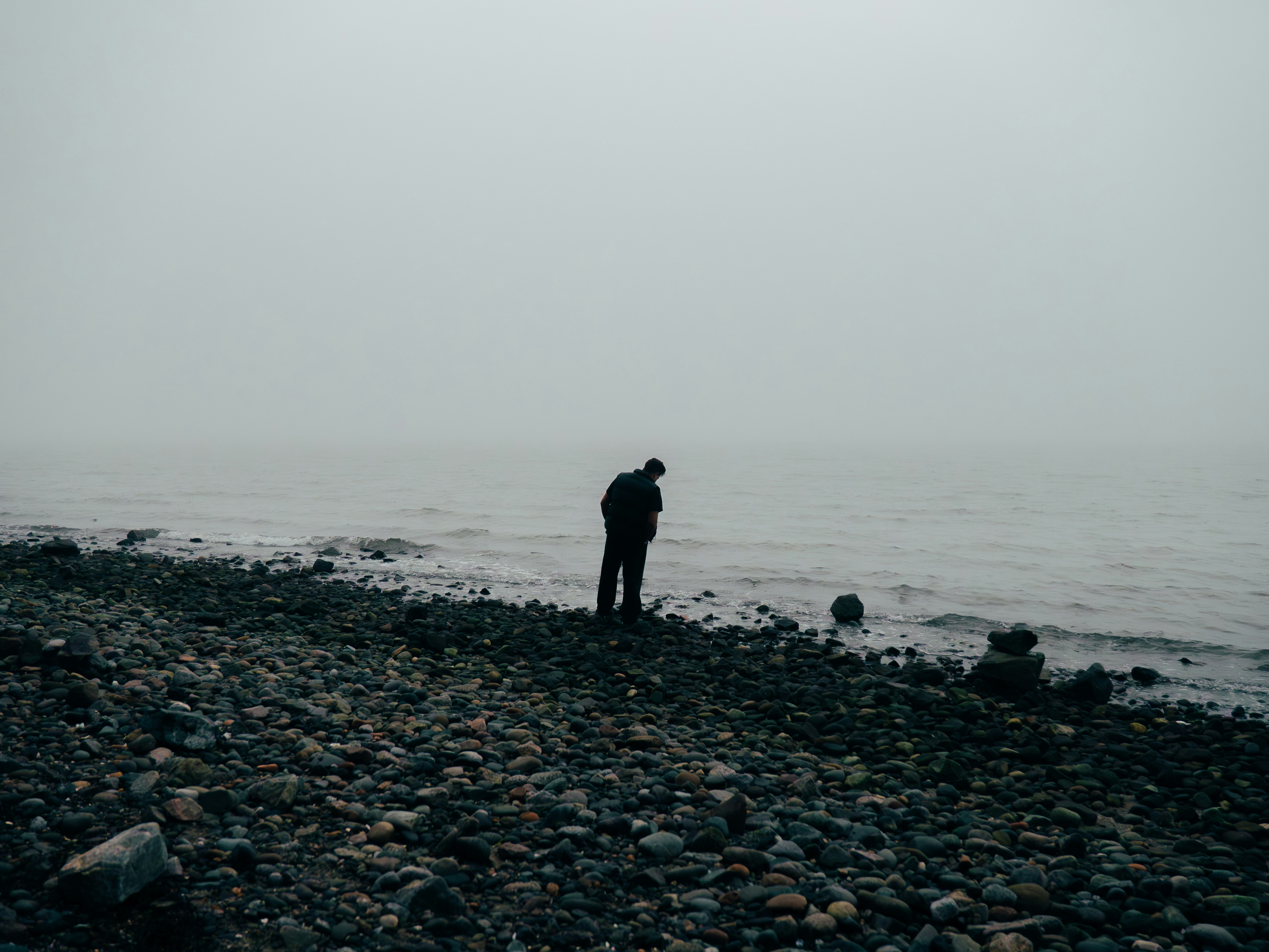 Silhouette of a person standing infront of Sea