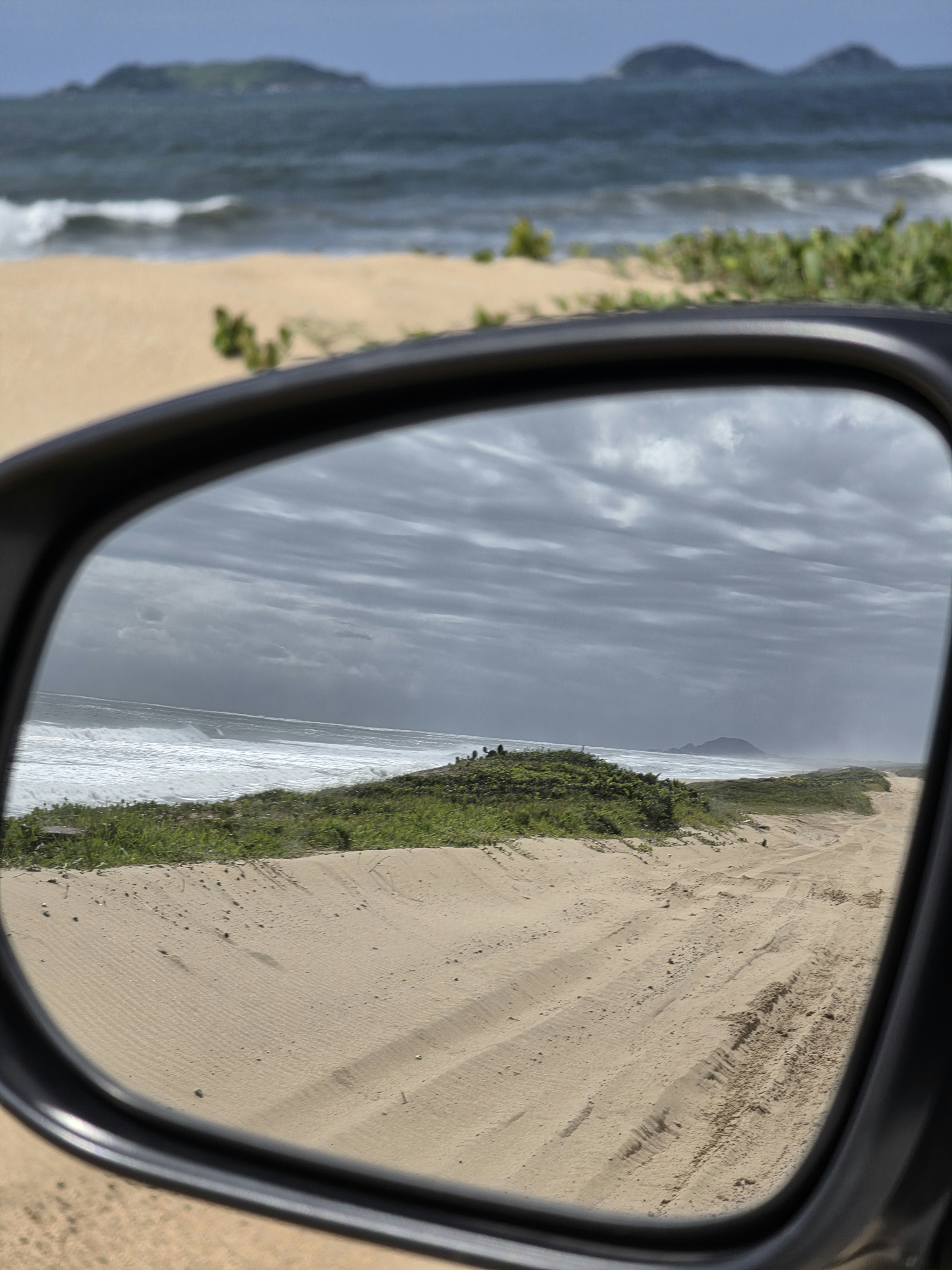 Rear-View Beach Gaze: Dunes and Ocean in the Side-Mirror Scene