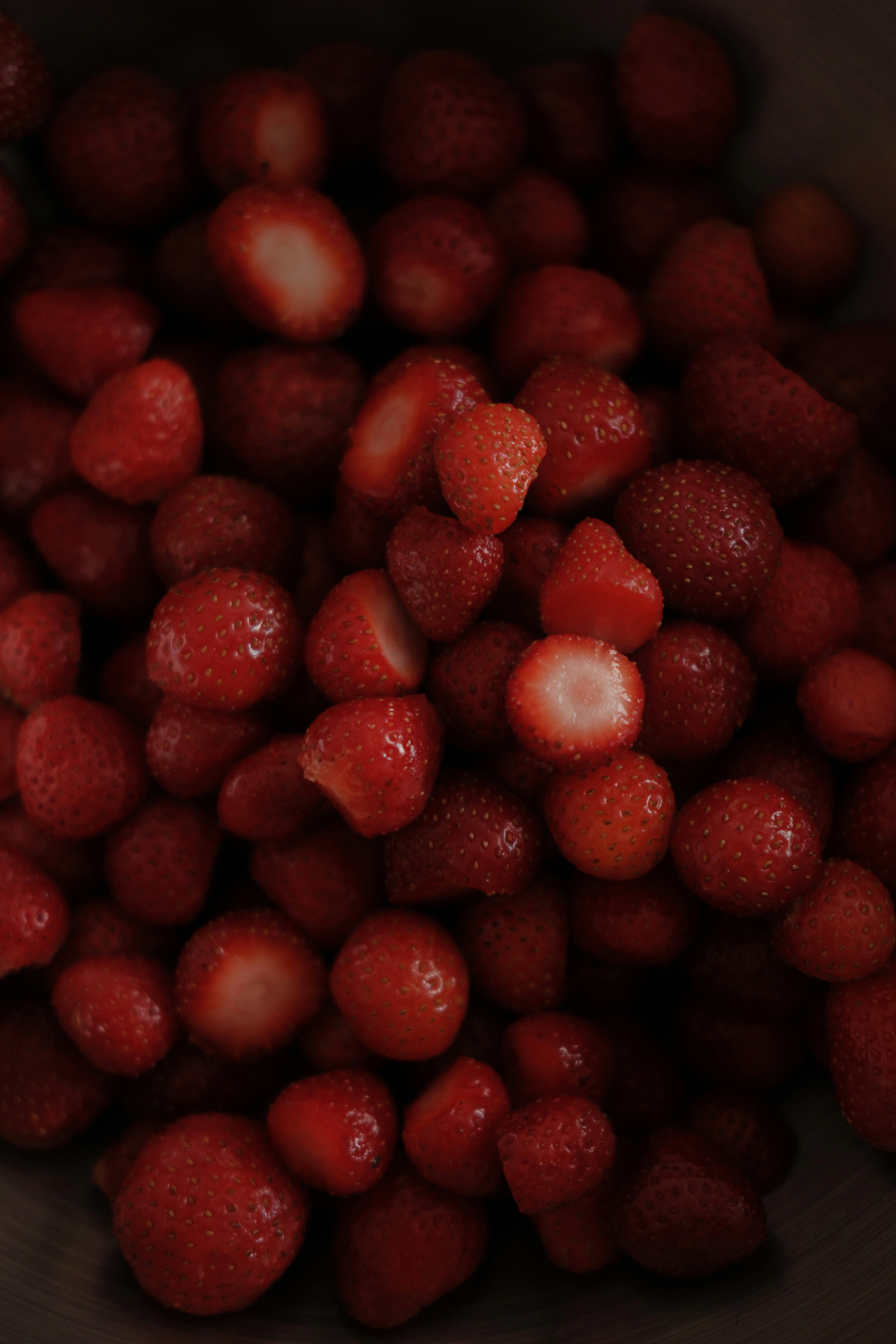 Crimson Harvest: Close-Pressed Berries in Low Light