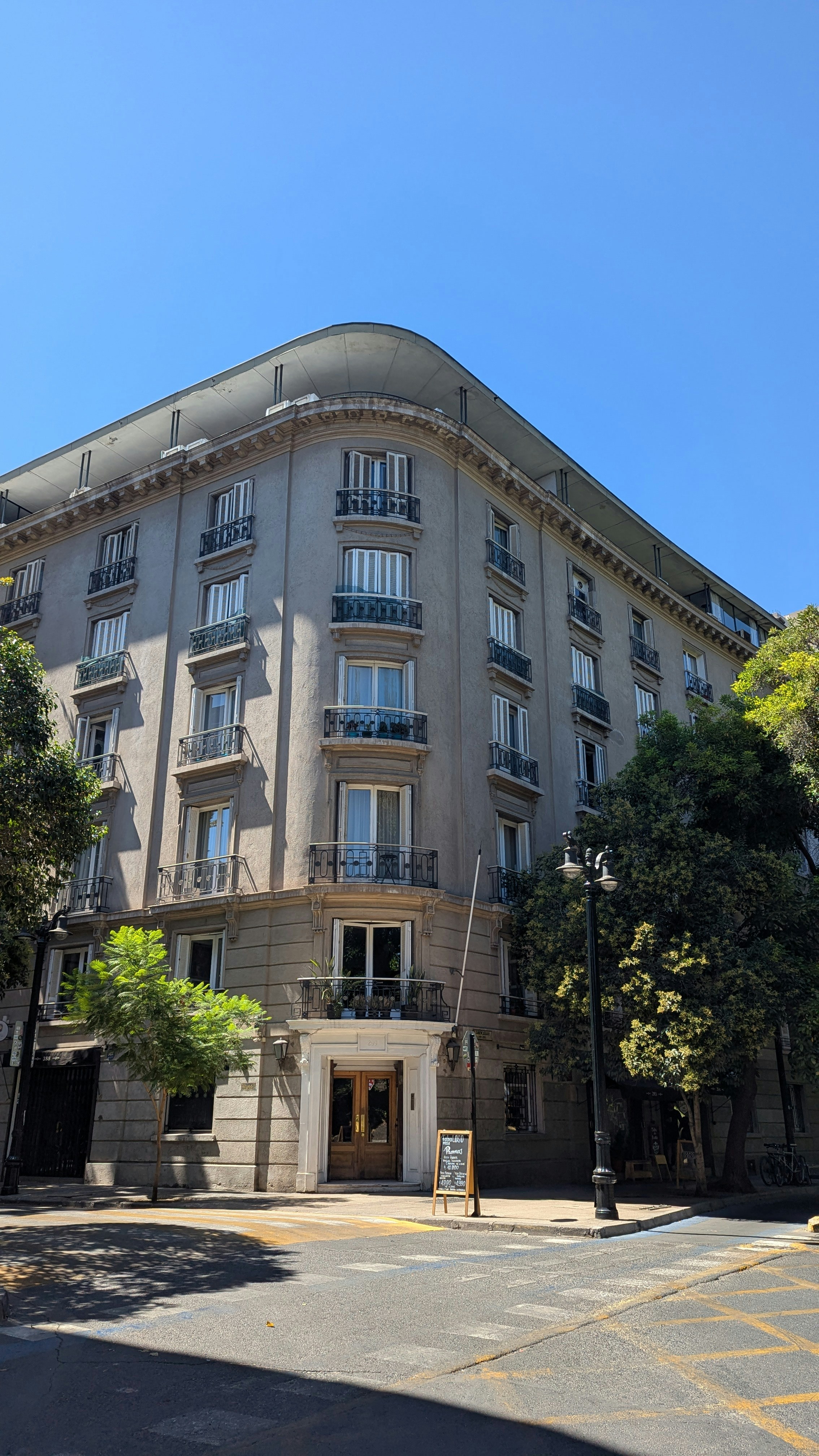 Cornerstone of Quiet Strength: A Cornerstone Building on a Sunlit Street