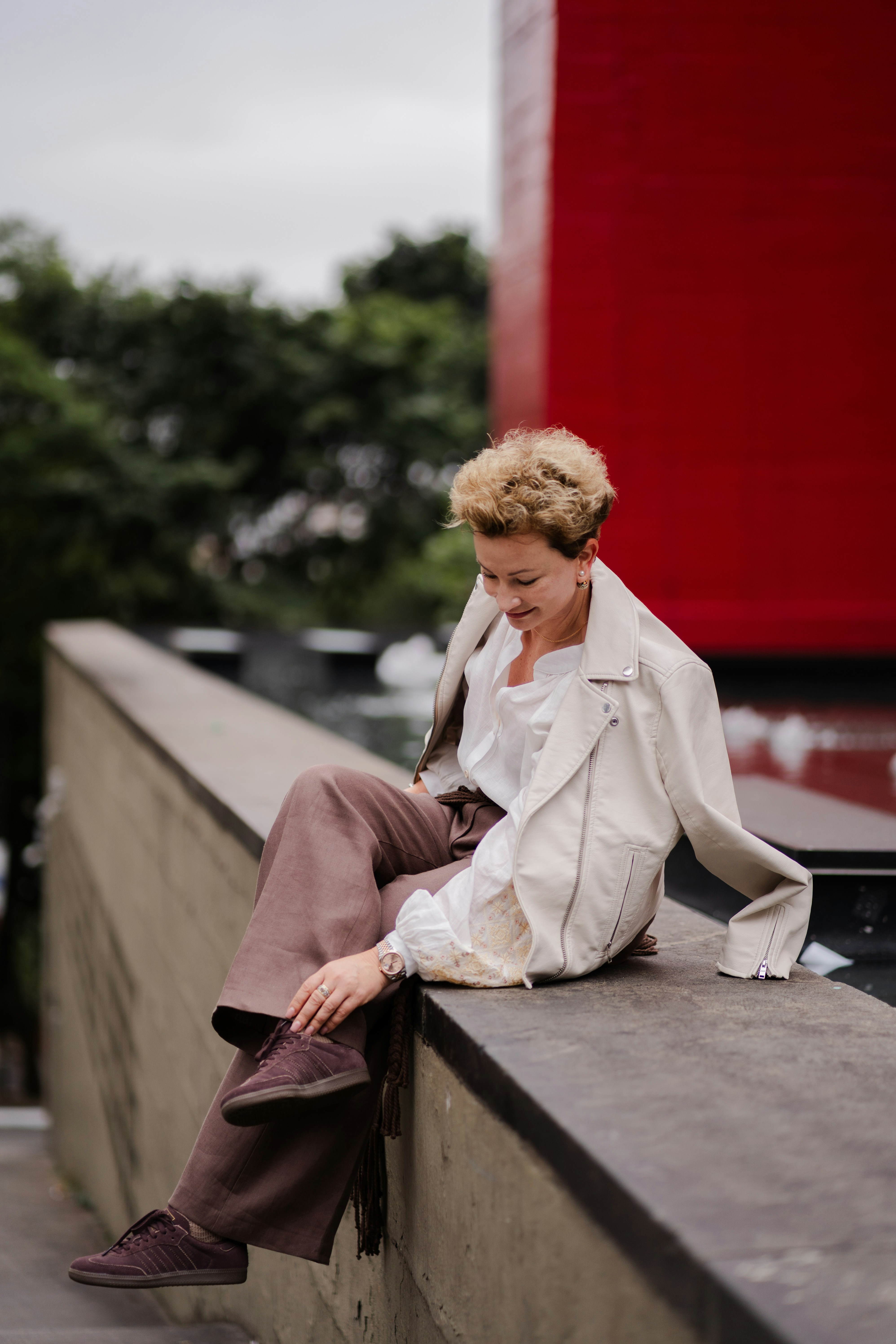 Rooftop Contemplation: A Quiet Moment in Pale Tones