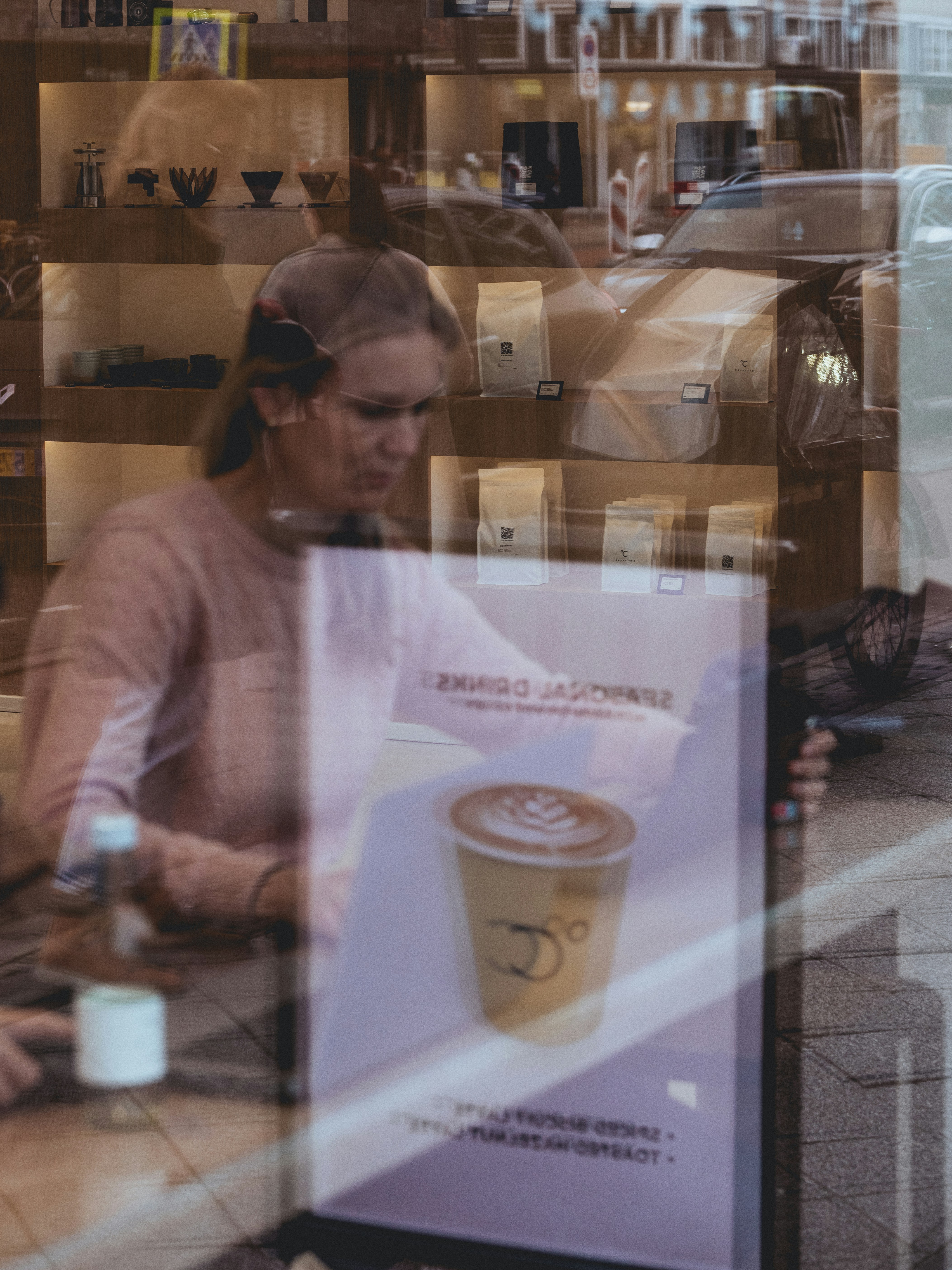 Glass Reflections and a Café Portrait in Transit