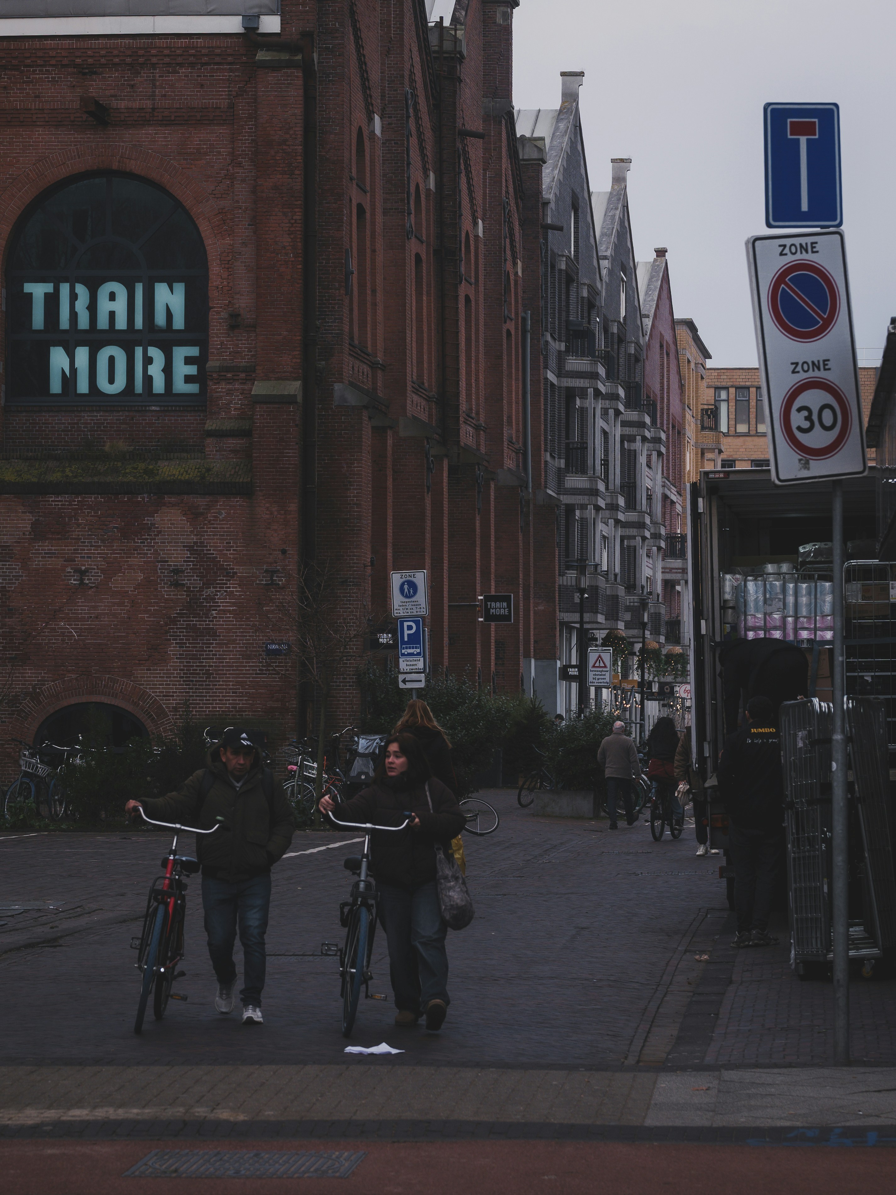 Beneath the Brick Facade: A City Street at Dusk