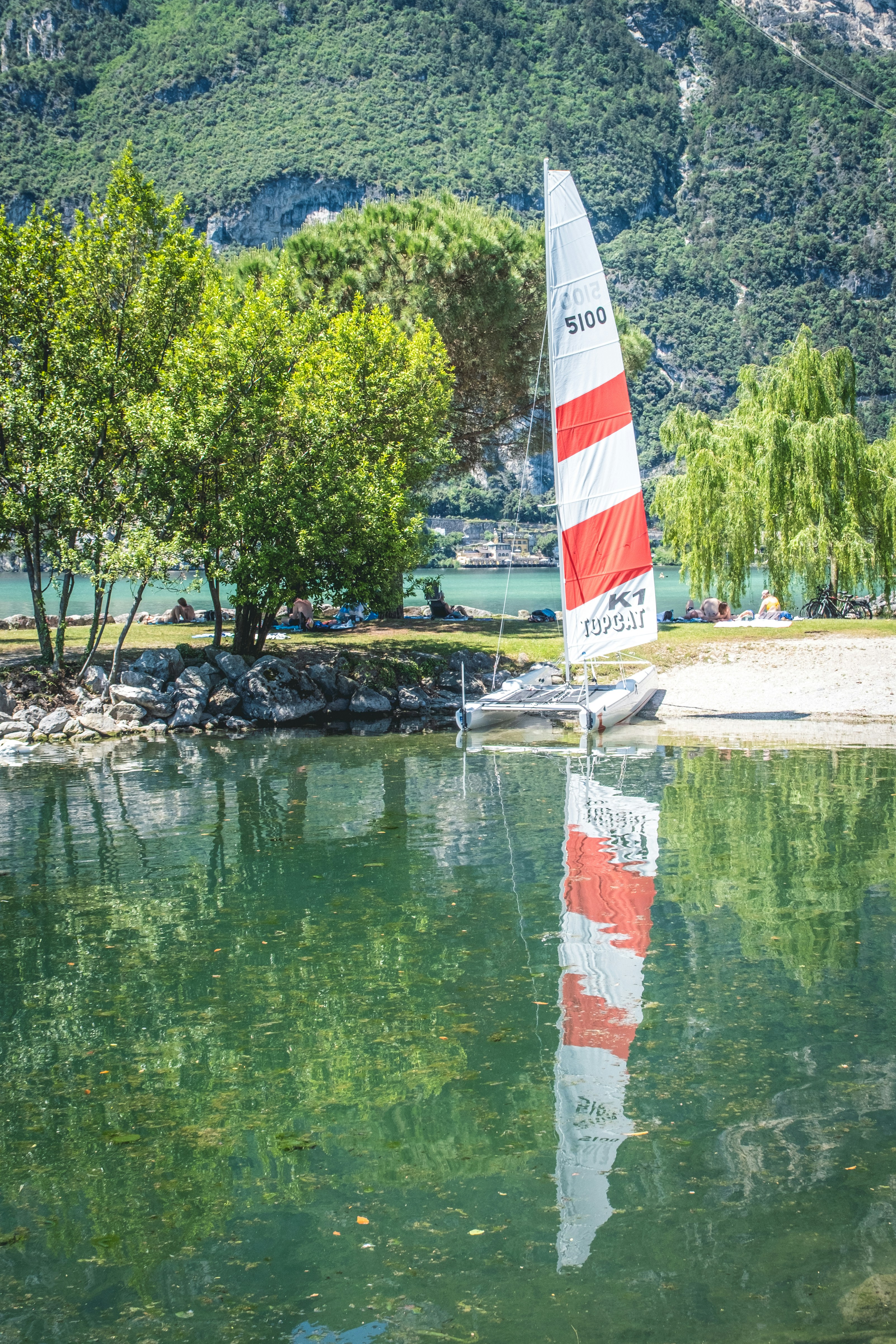 Sail and Mirror: A Quiet Lakeside Moment