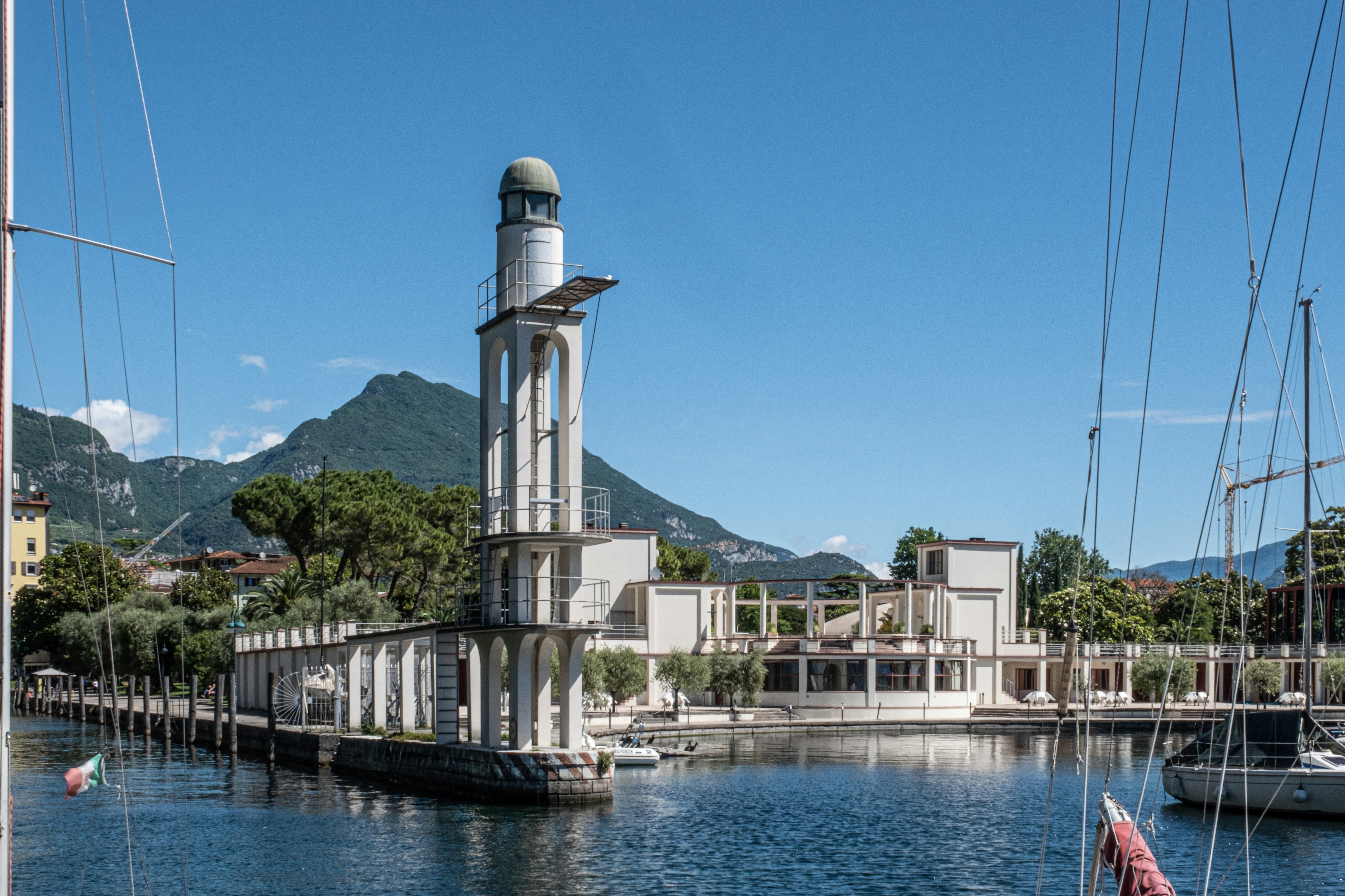 Marina Lantern: A Towering Maritime Structure Framed by Sails