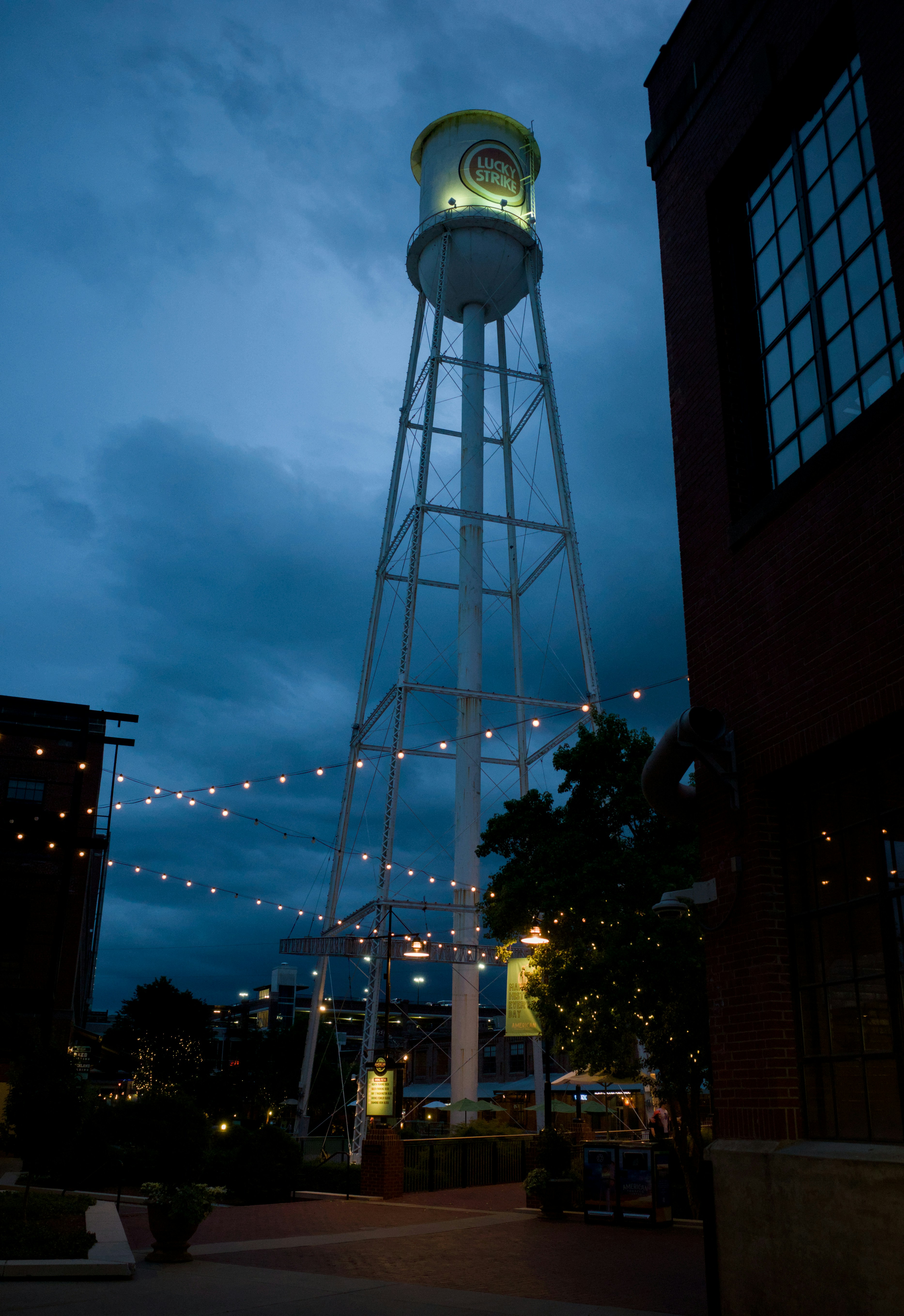 Midnight Oasis: The Water Tower Under Strung Lights
