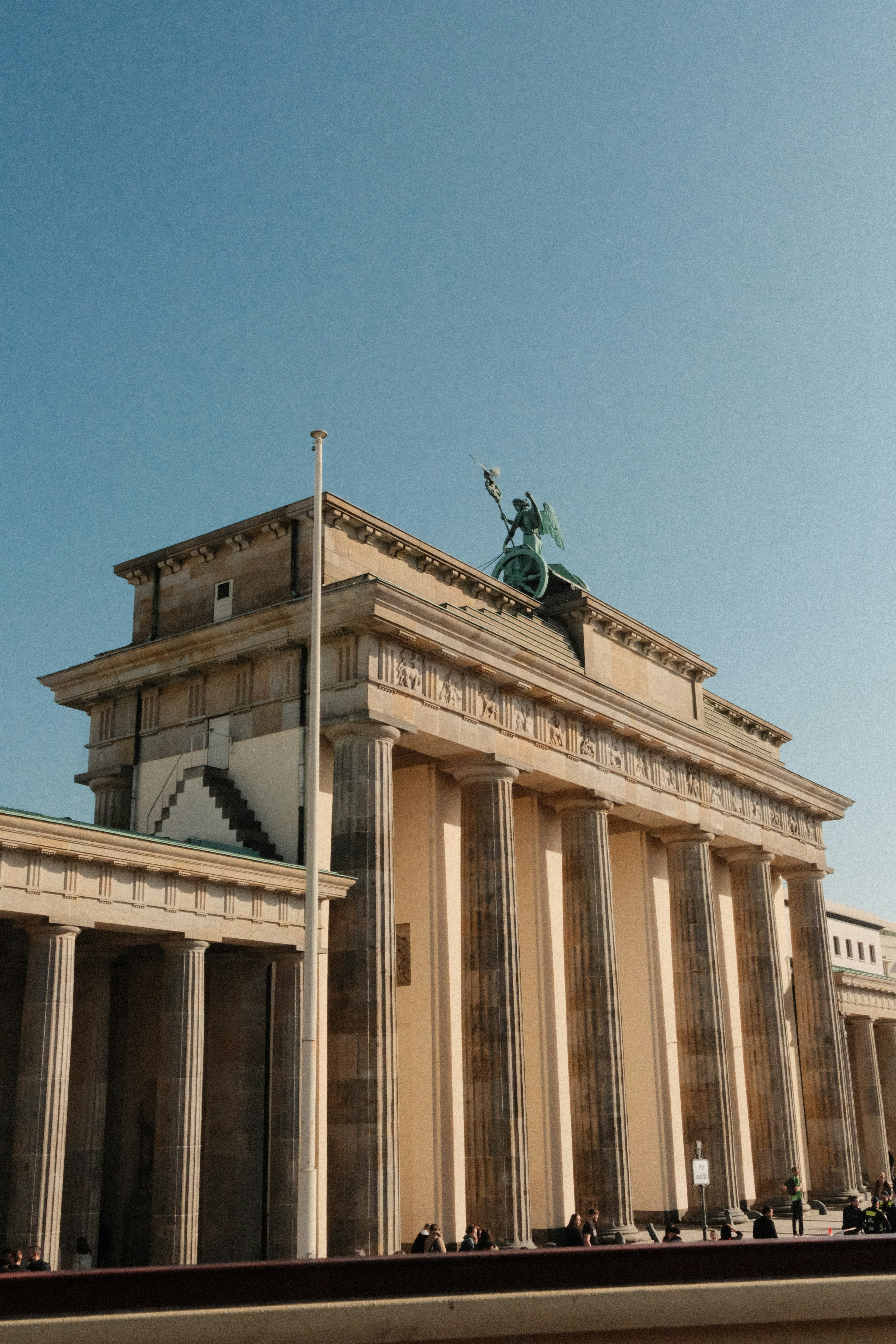 Columned Grandeur: Neoclassical Facade Under a Clear Sky