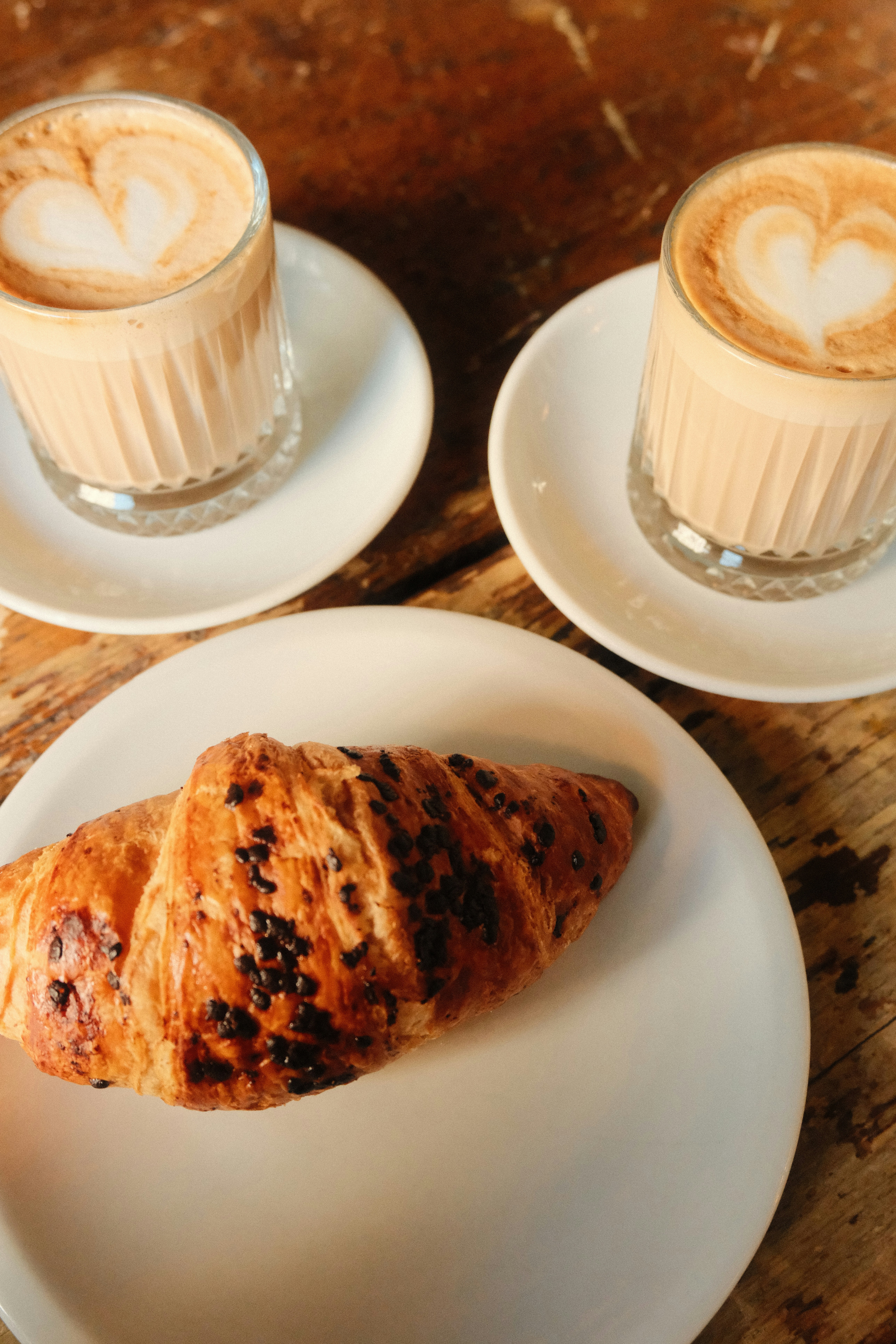 Warm Morning Break: Two Lattes and a Golden Croissant