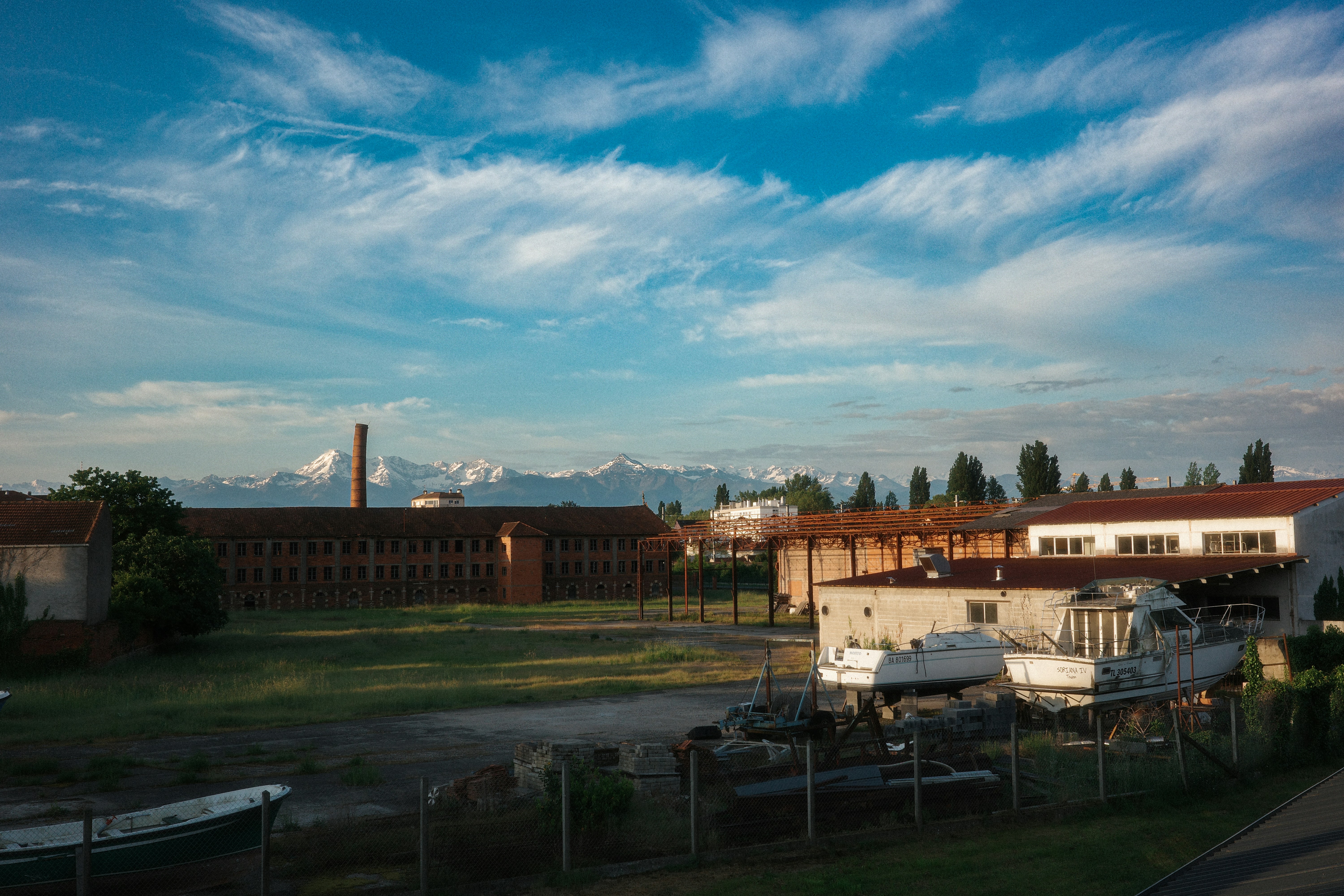 Sunlit Shipyard and Industrial Campus Beneath a Open Sky