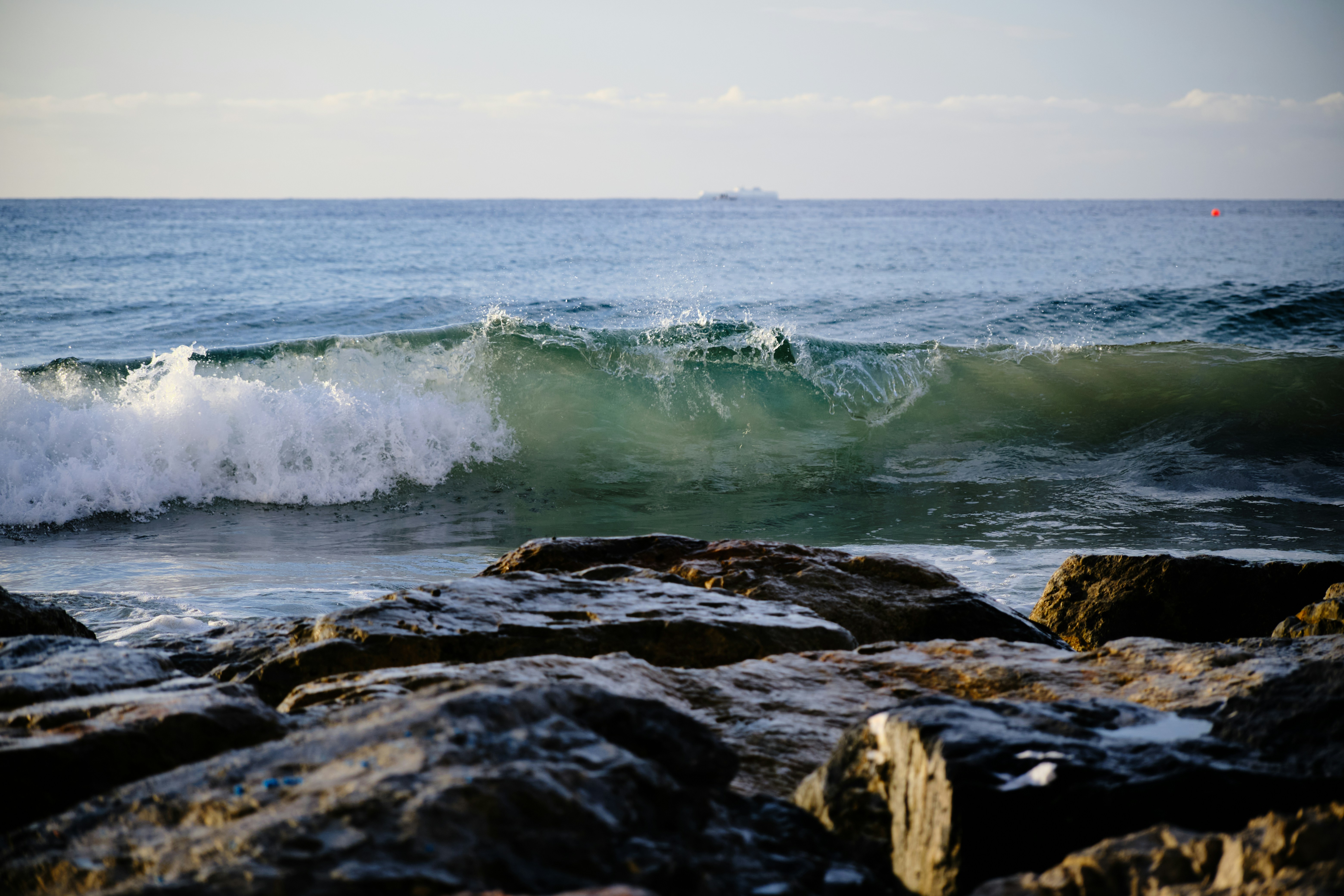 Coastal Crest: Light on Stones at the Break