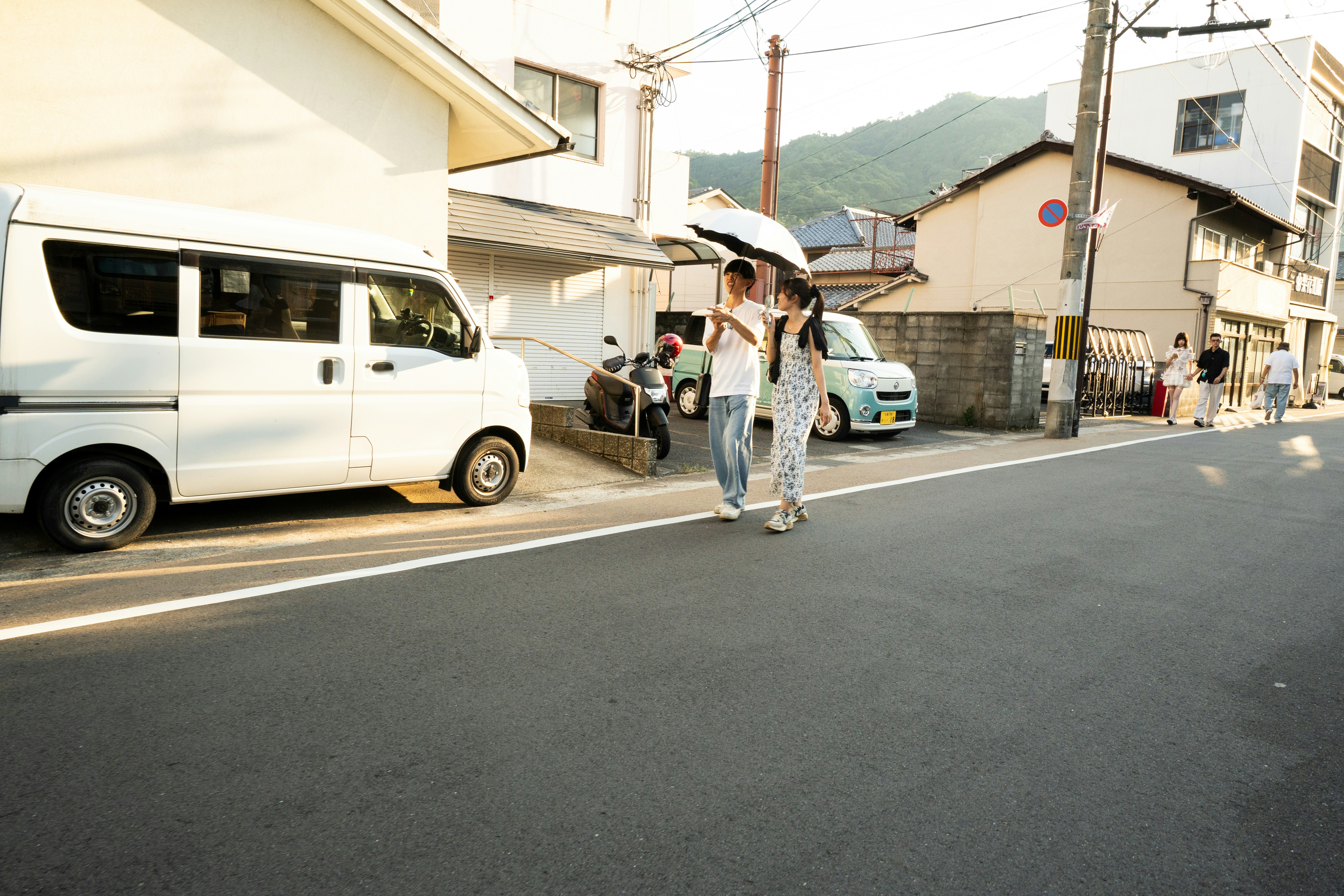 Umbrella Walk: Street Scene with Friends on a Sunny Day