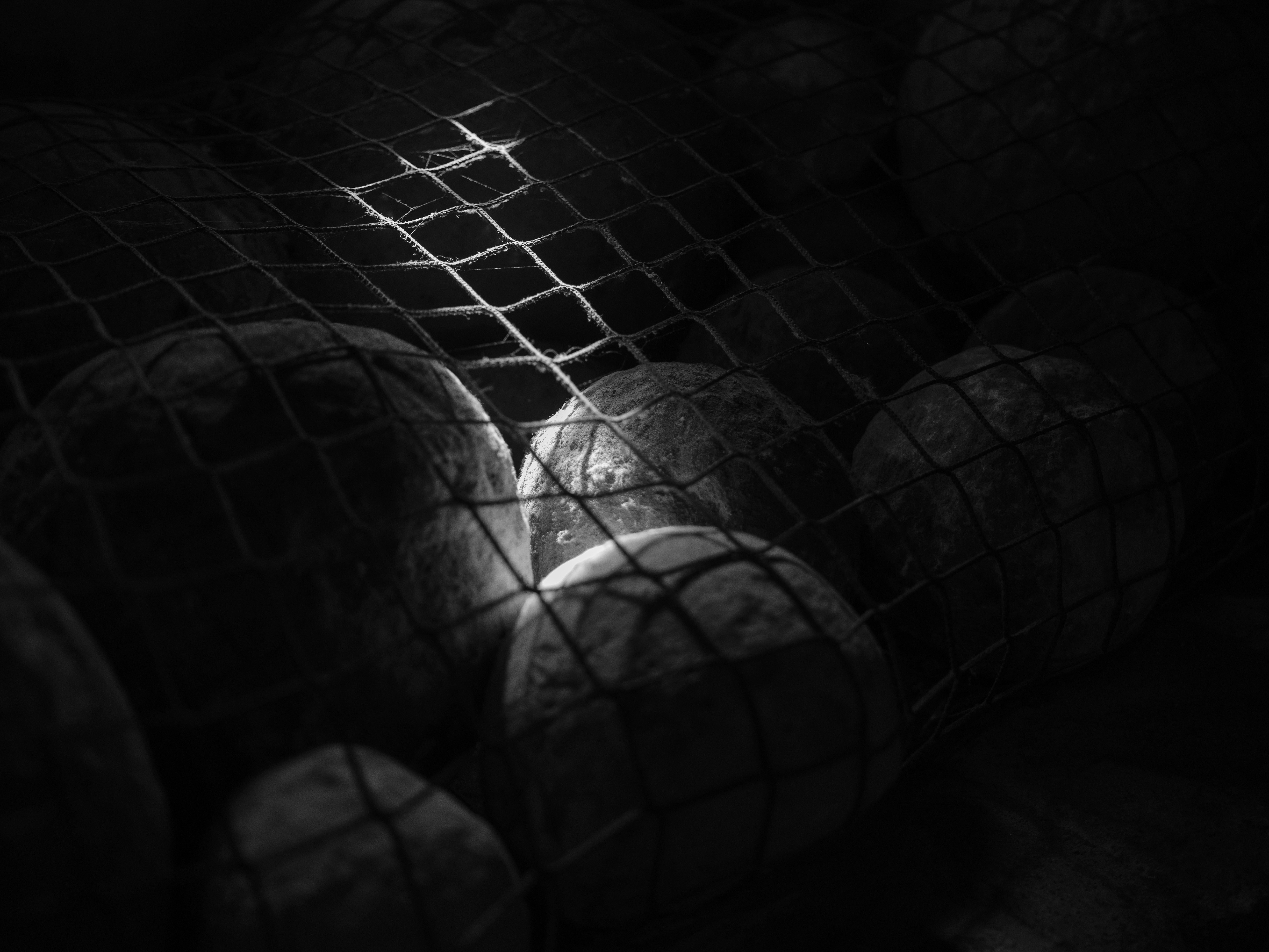 Moonlit Net of Stones: A Quiet Corner in Darkness