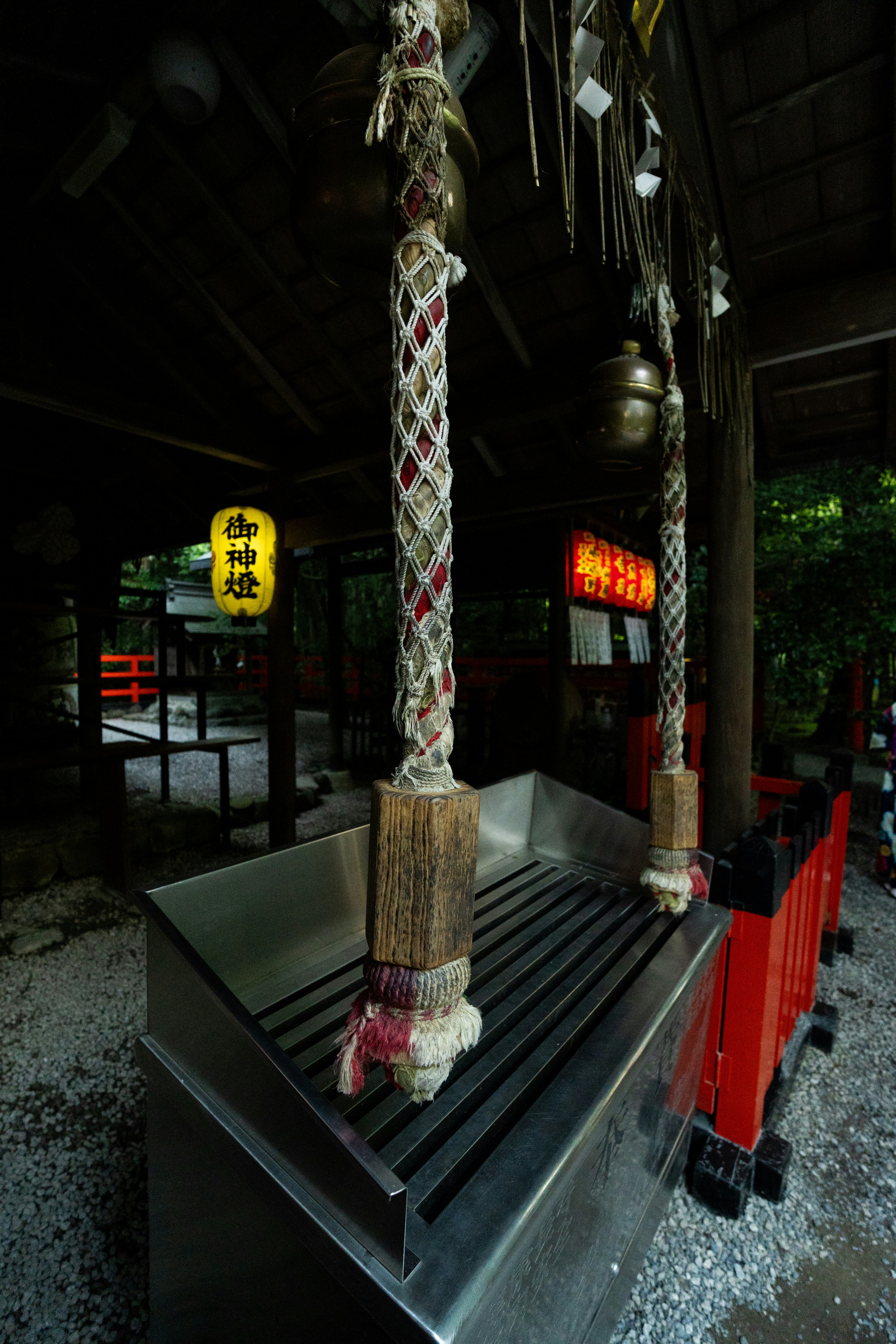 Ritual Ropes and Steel Shrine: A Quiet Moment Under Twilight Lanterns