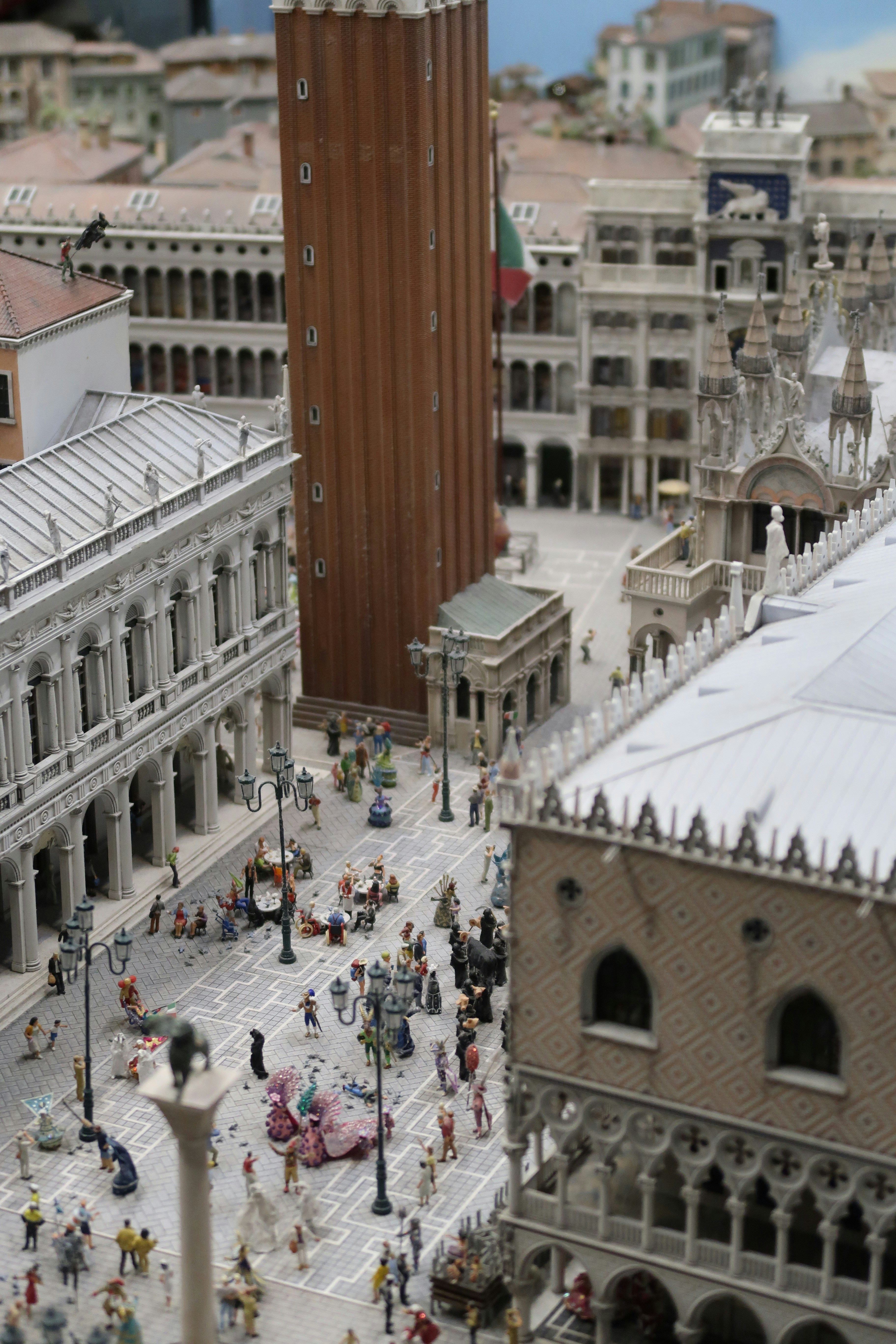 Miniature Piazza: A Detailed City Scene Under Tall Clocktower