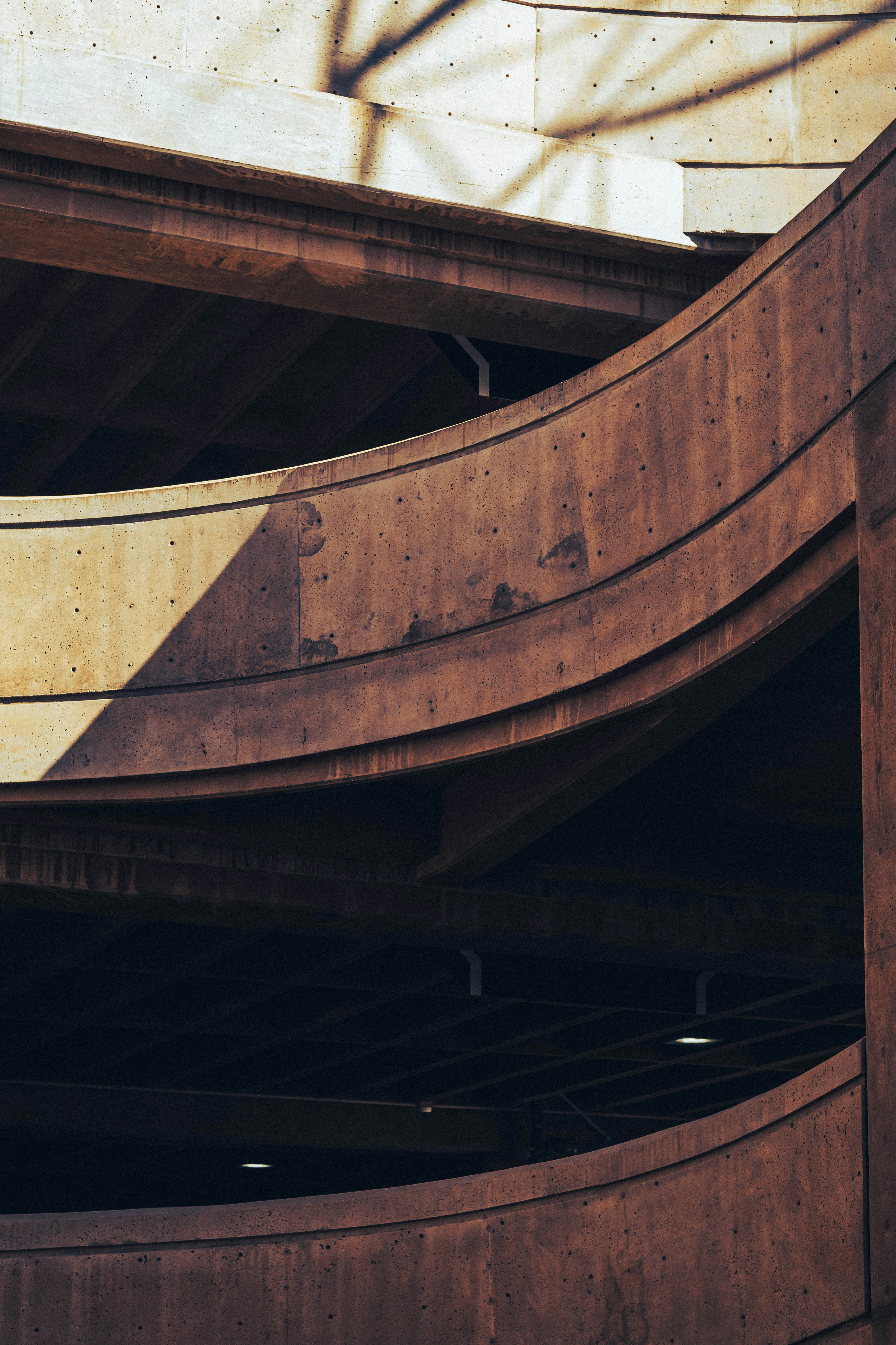 Concrete Echoes: Curved Ramps and Shadows in Urban Light
