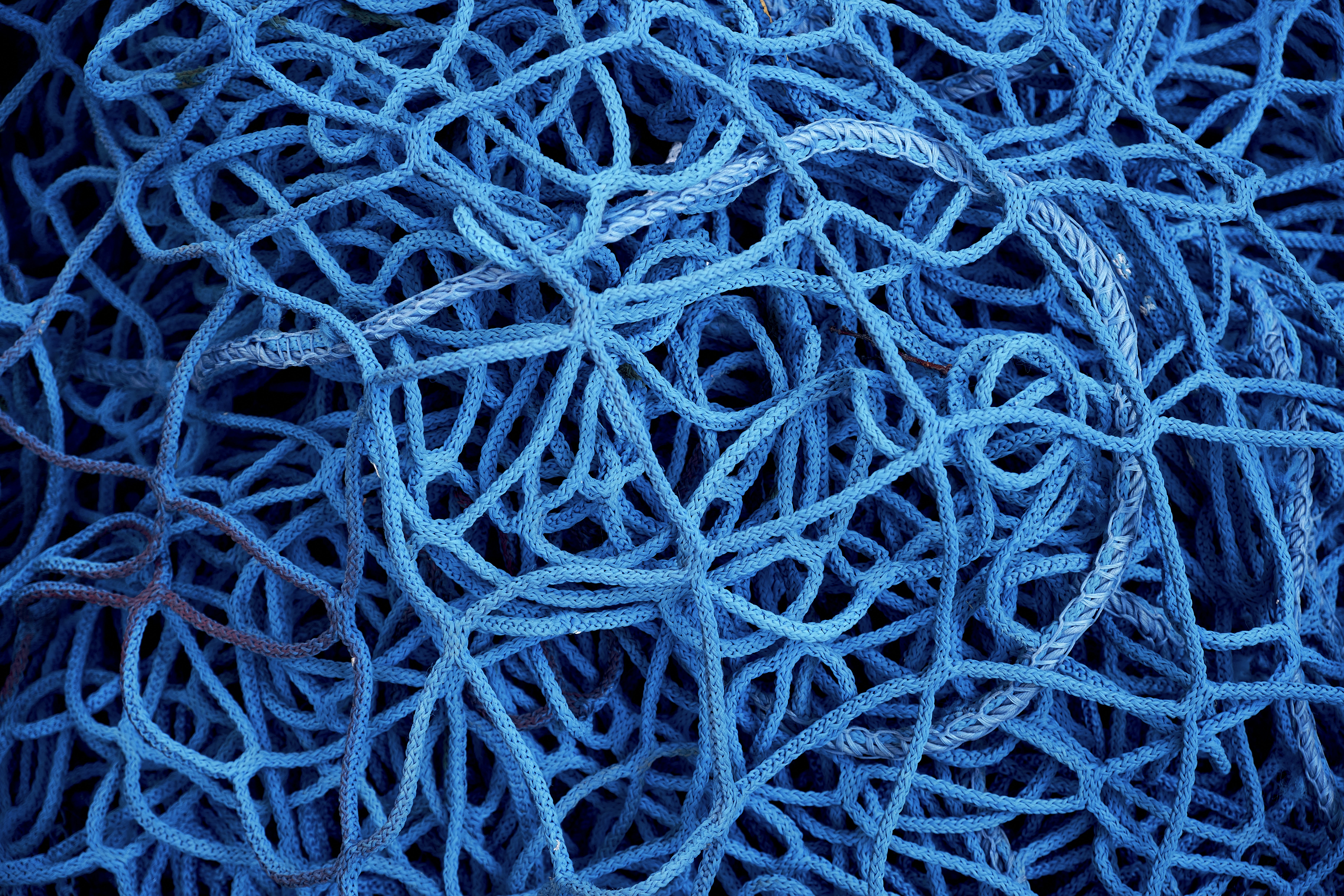 Abstract pattern of tangled vibrant blue net.