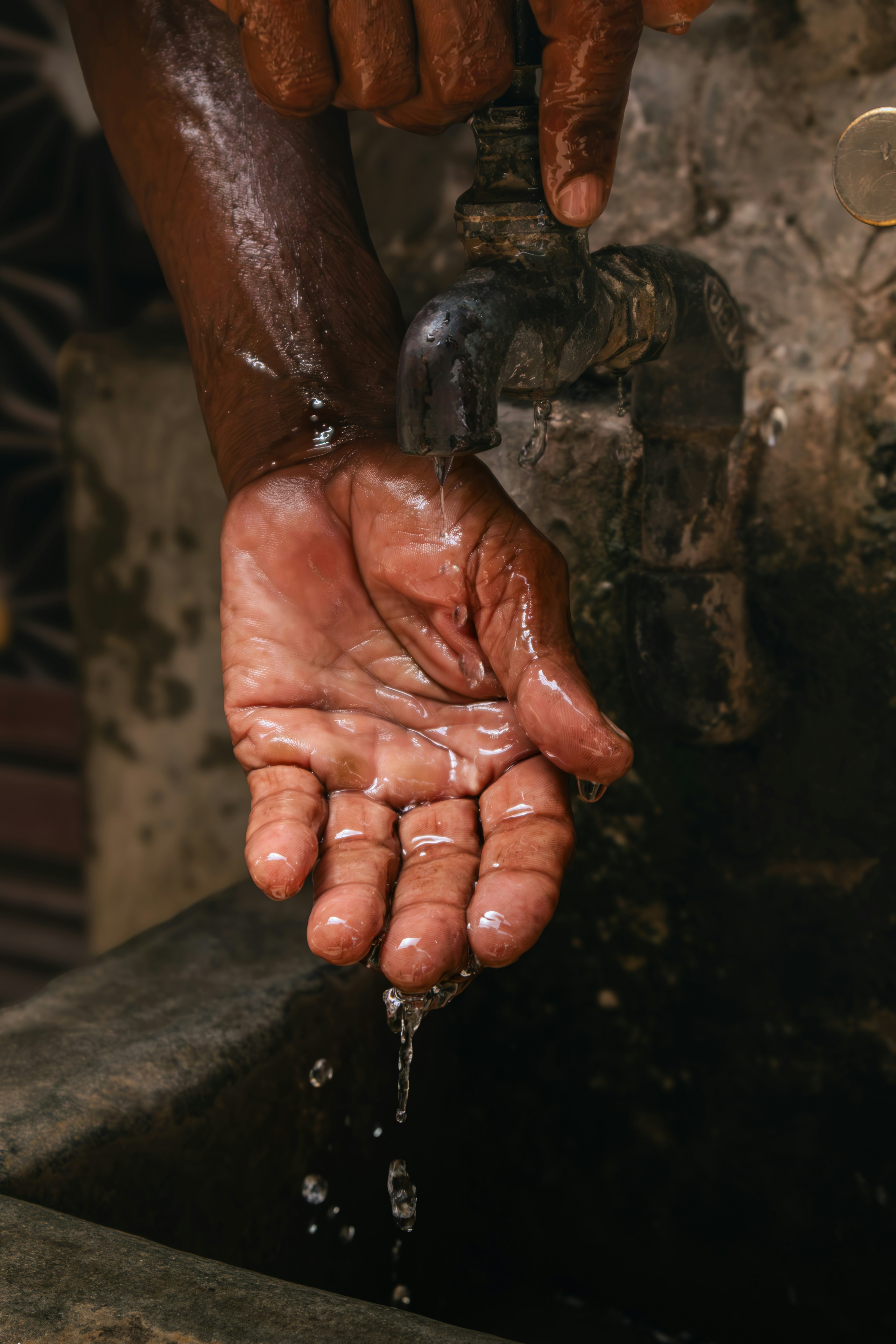 Hands Beneath a Steady Stream: Labor and Water