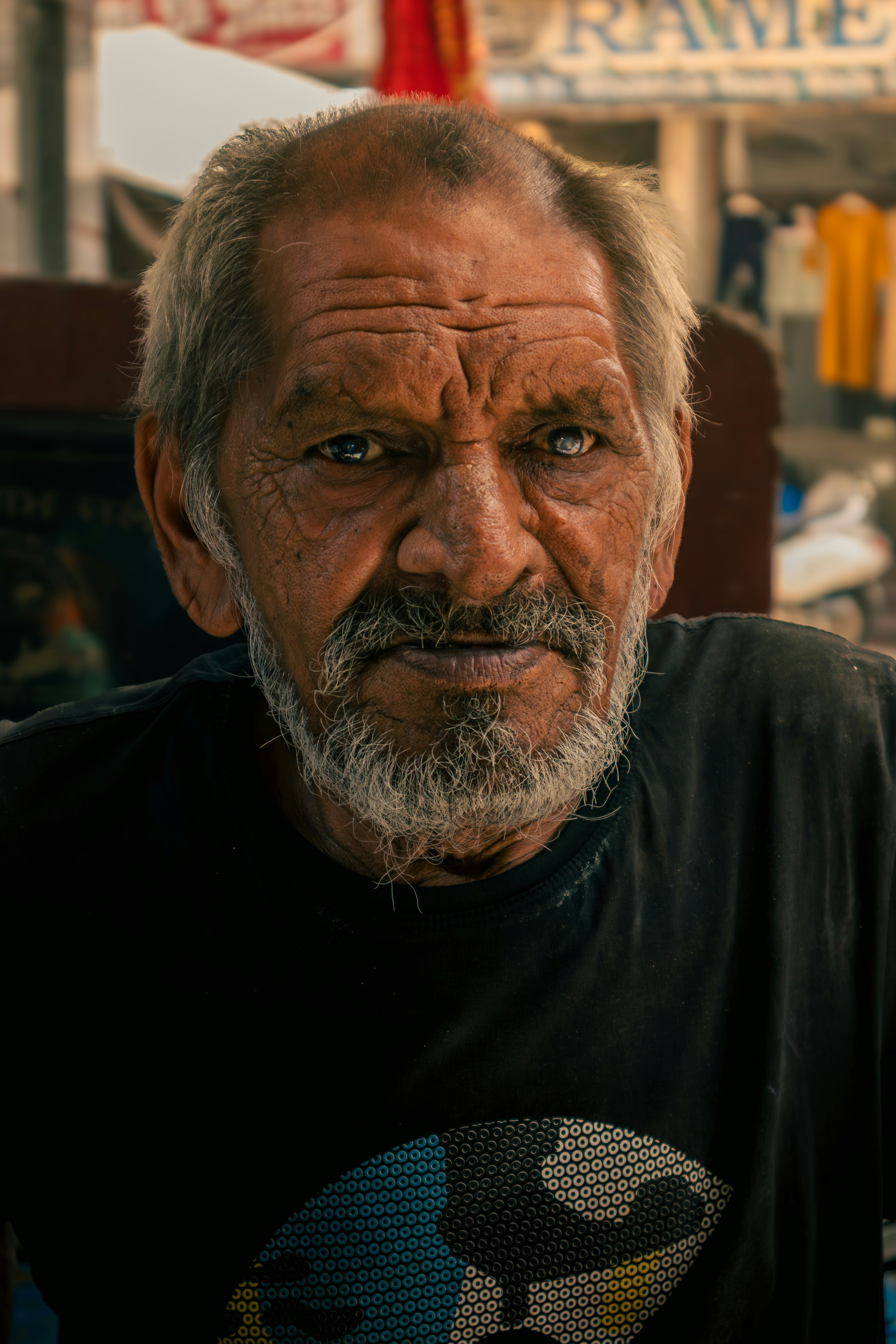 Weathered Wisdom: A Portrait in Harsh Light and Quiet Grit