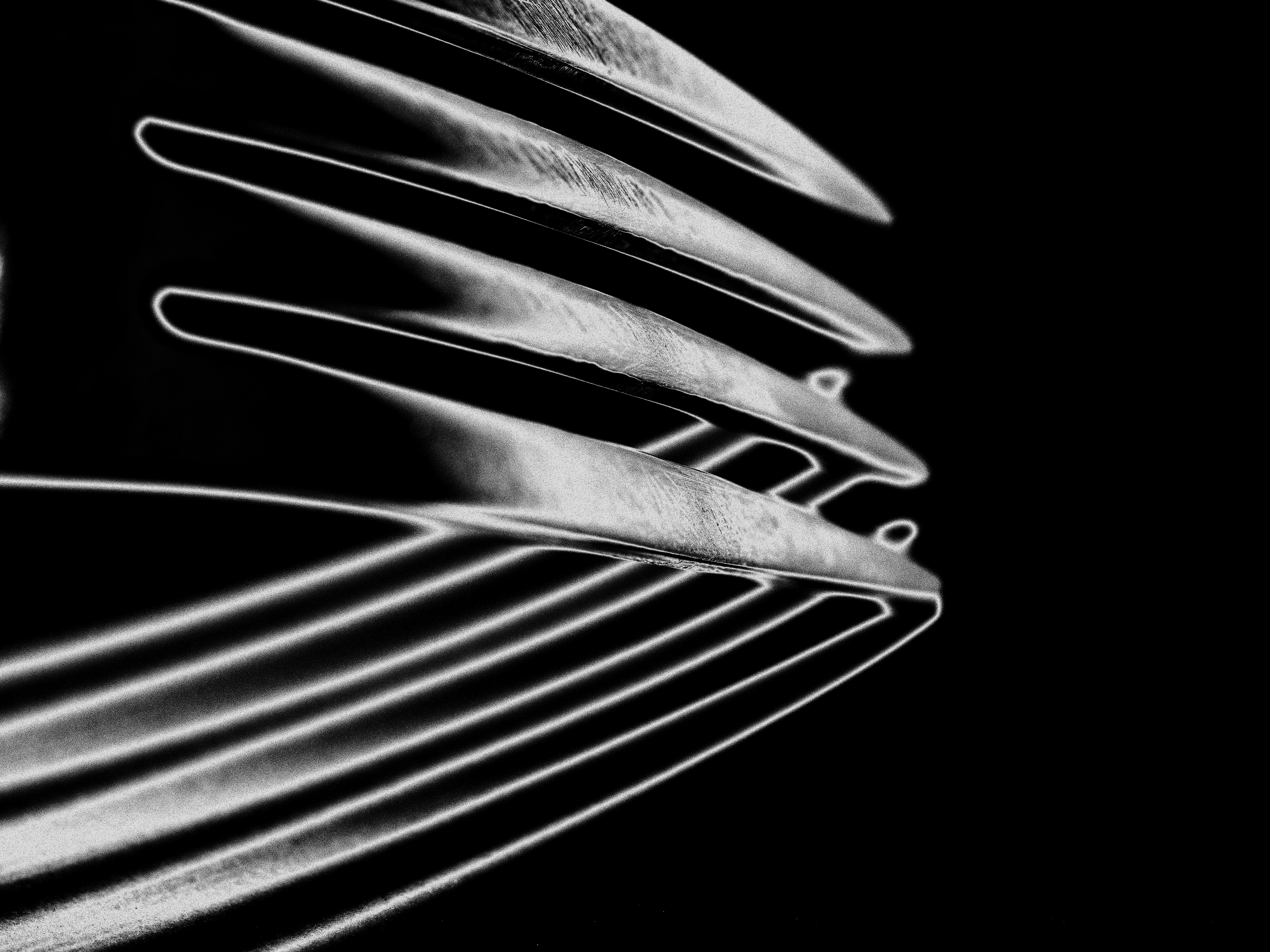 Curved chrome ribs in stark black contrast