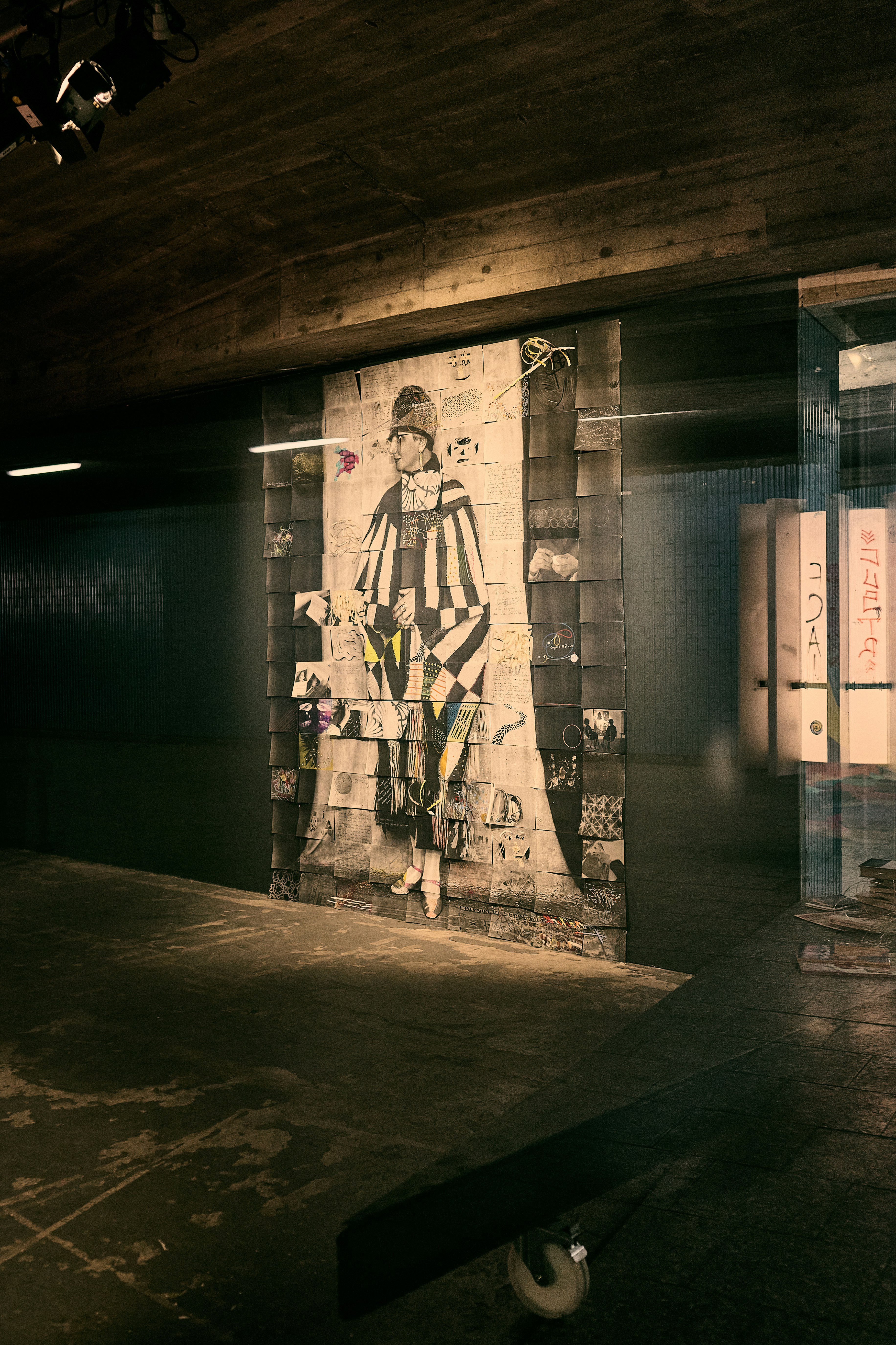 Graffitied Portrait in a Dim Subway Corridor