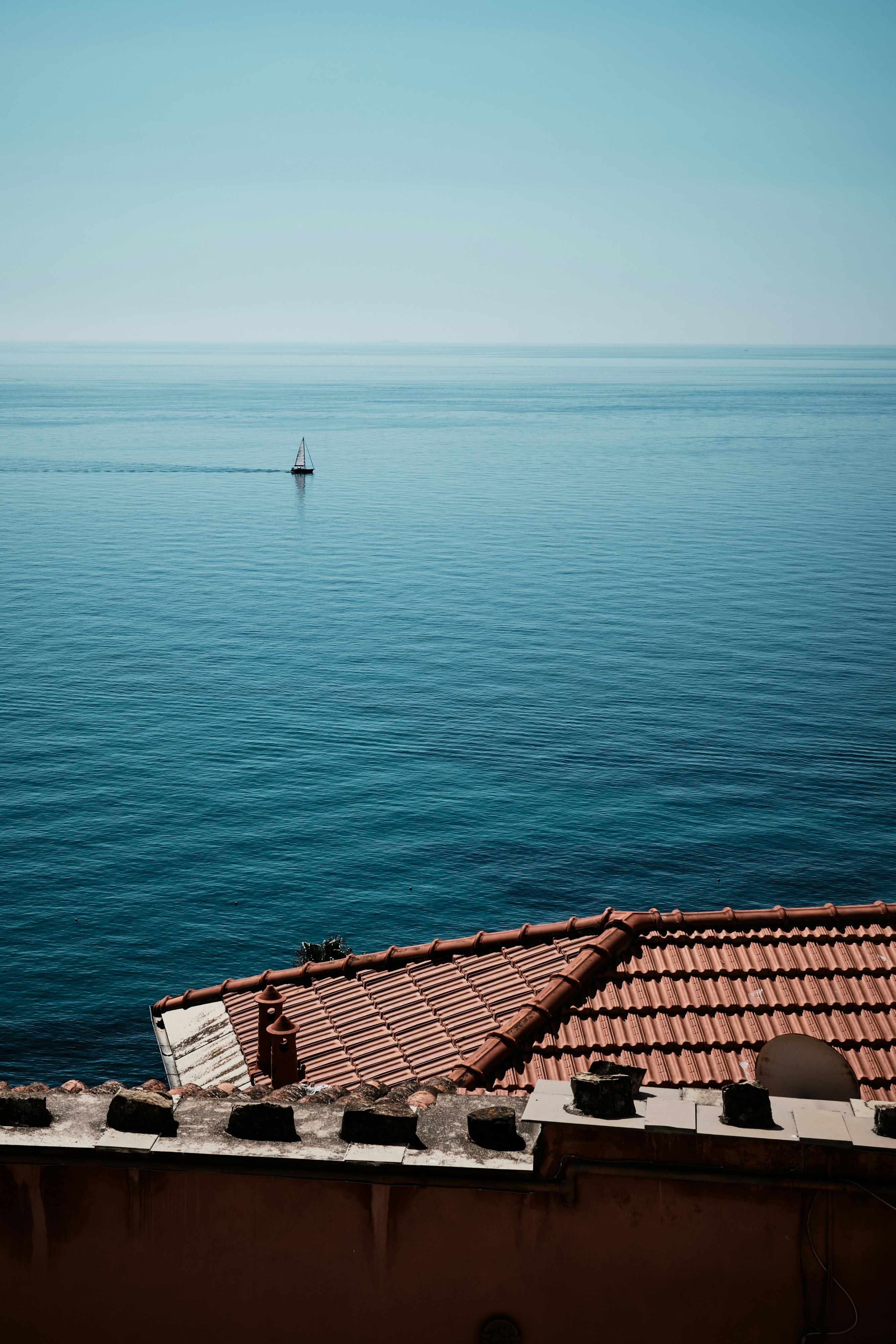Sailor on the Quiet Sea: A Sliver of Life Between Roof and Horizon