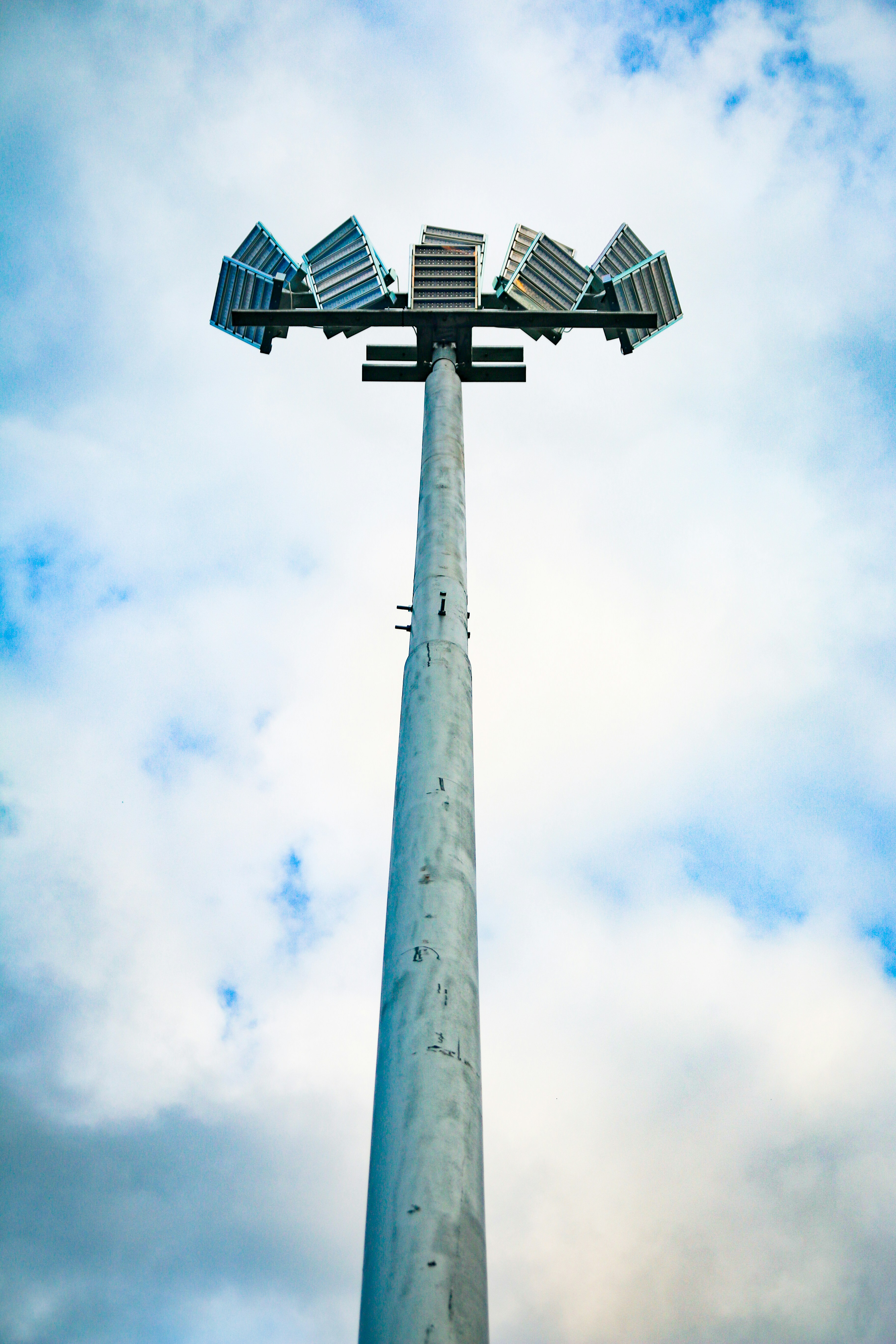 Tall Silence: A Vigilant Lightpole Reaches for the Sky