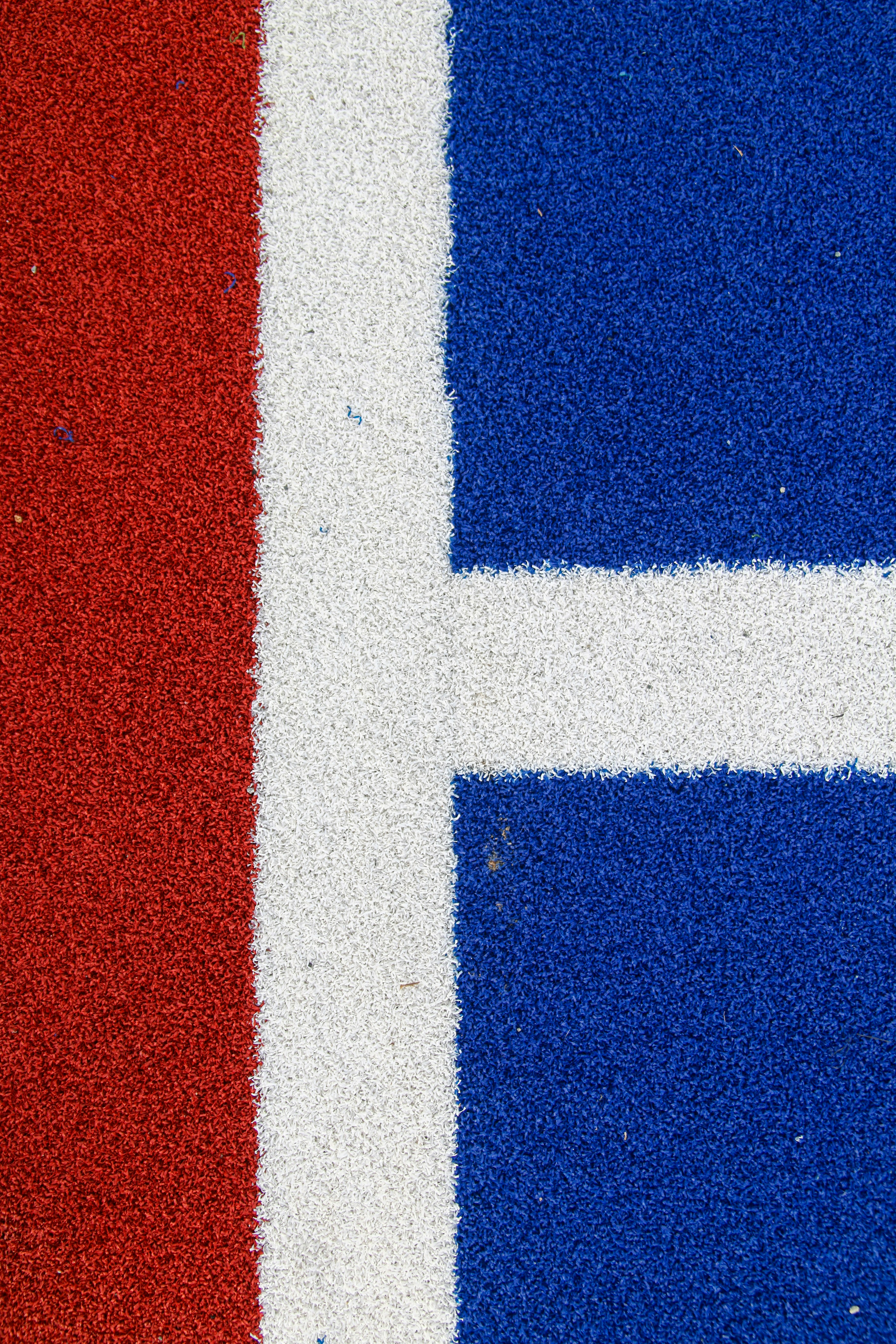 Color blocks on a rubberized track surface