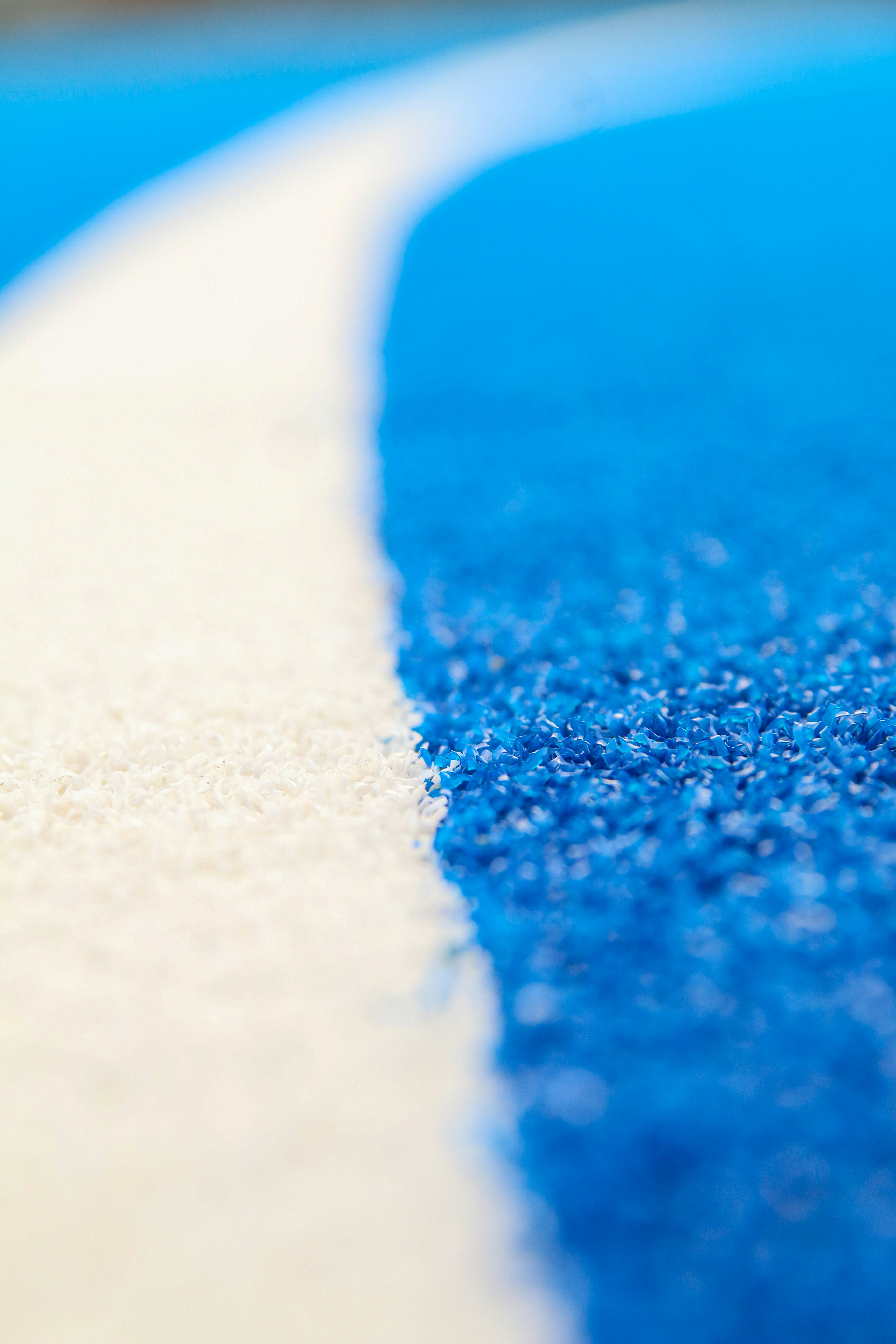 Edge of Color: A Curved Path Through Paint-like Blue and Cream