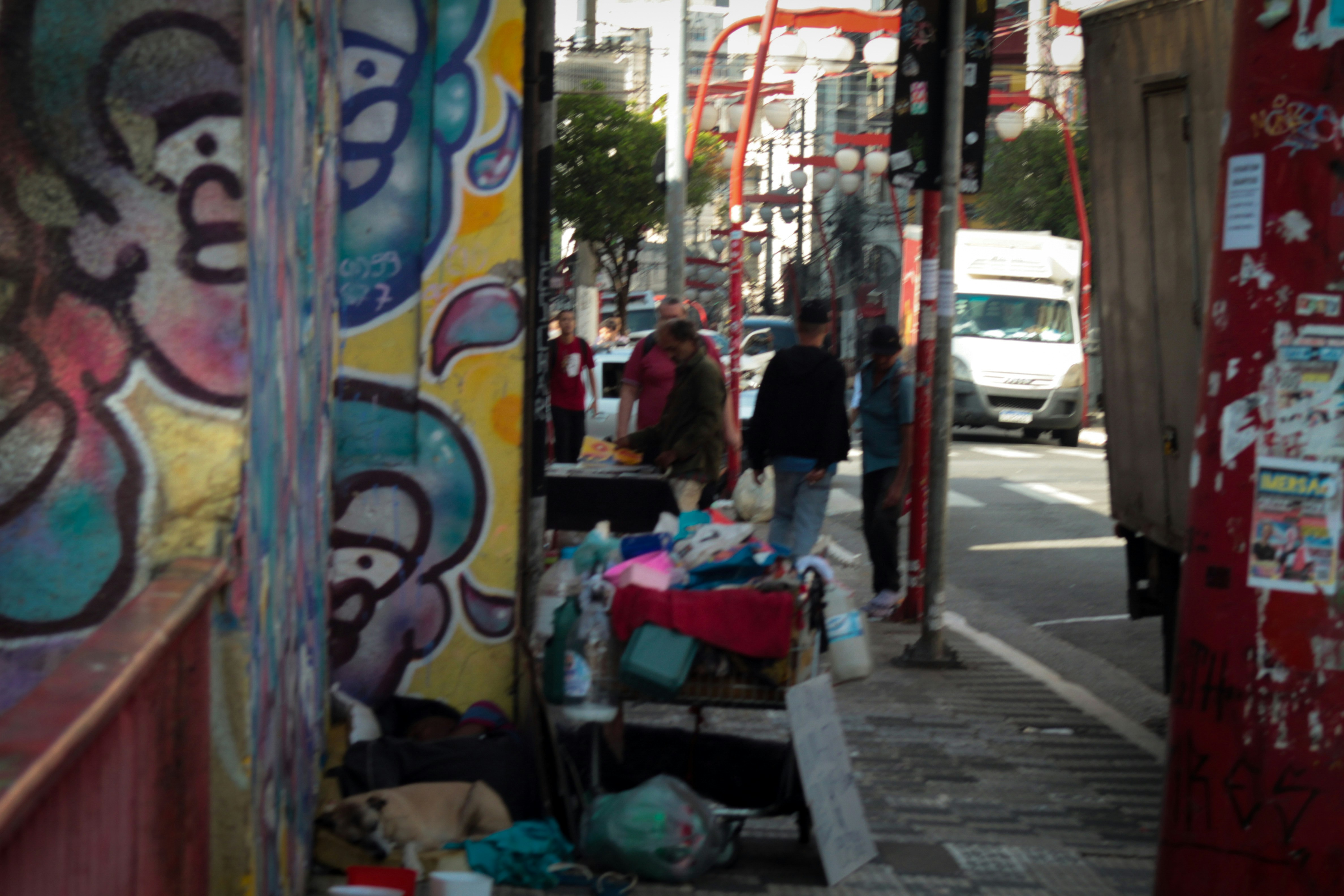 City alley in bloom of color: a cluttered sidewalk scene