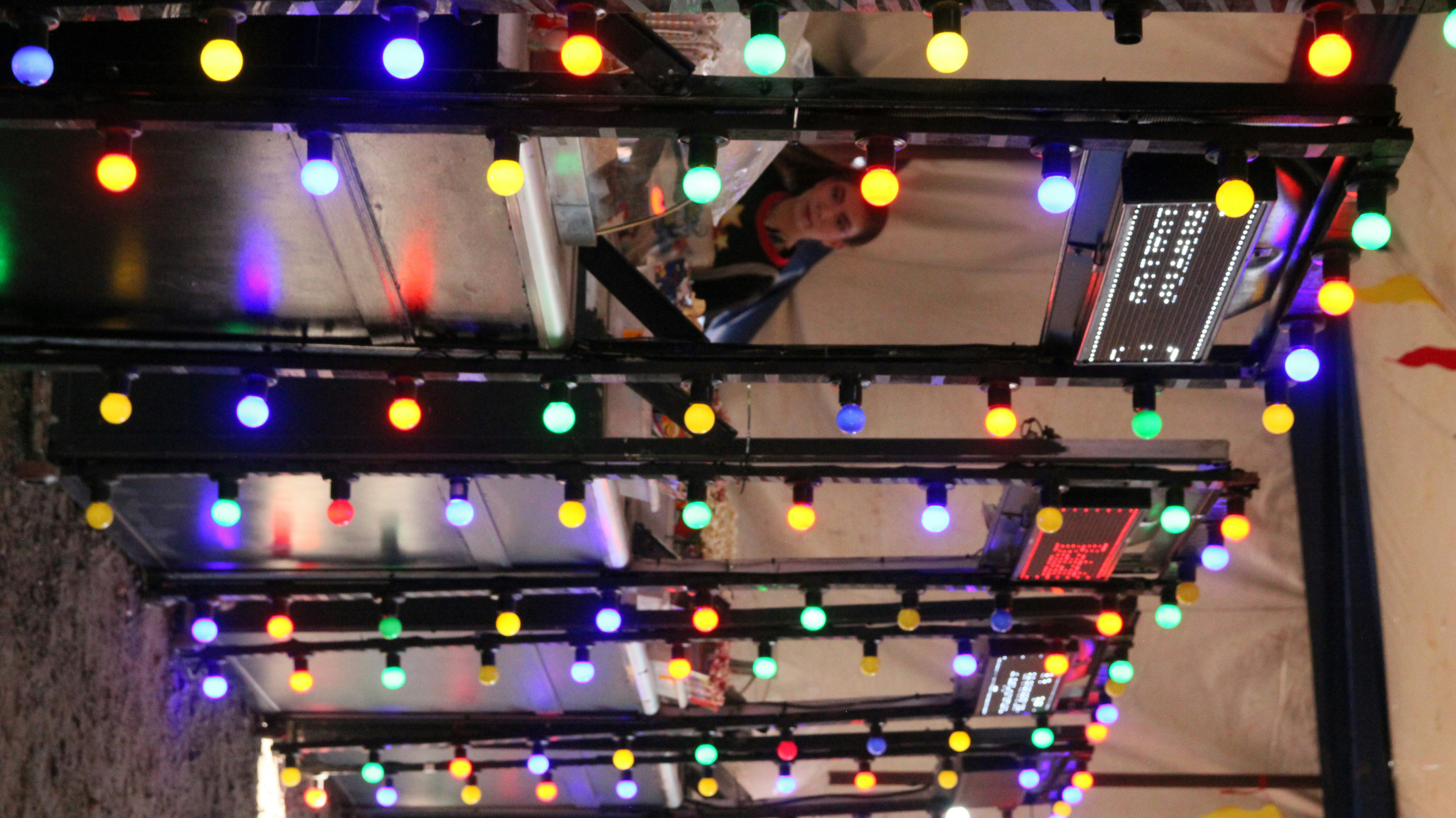 Tangled Glow: A Corridor of Festive Lights
