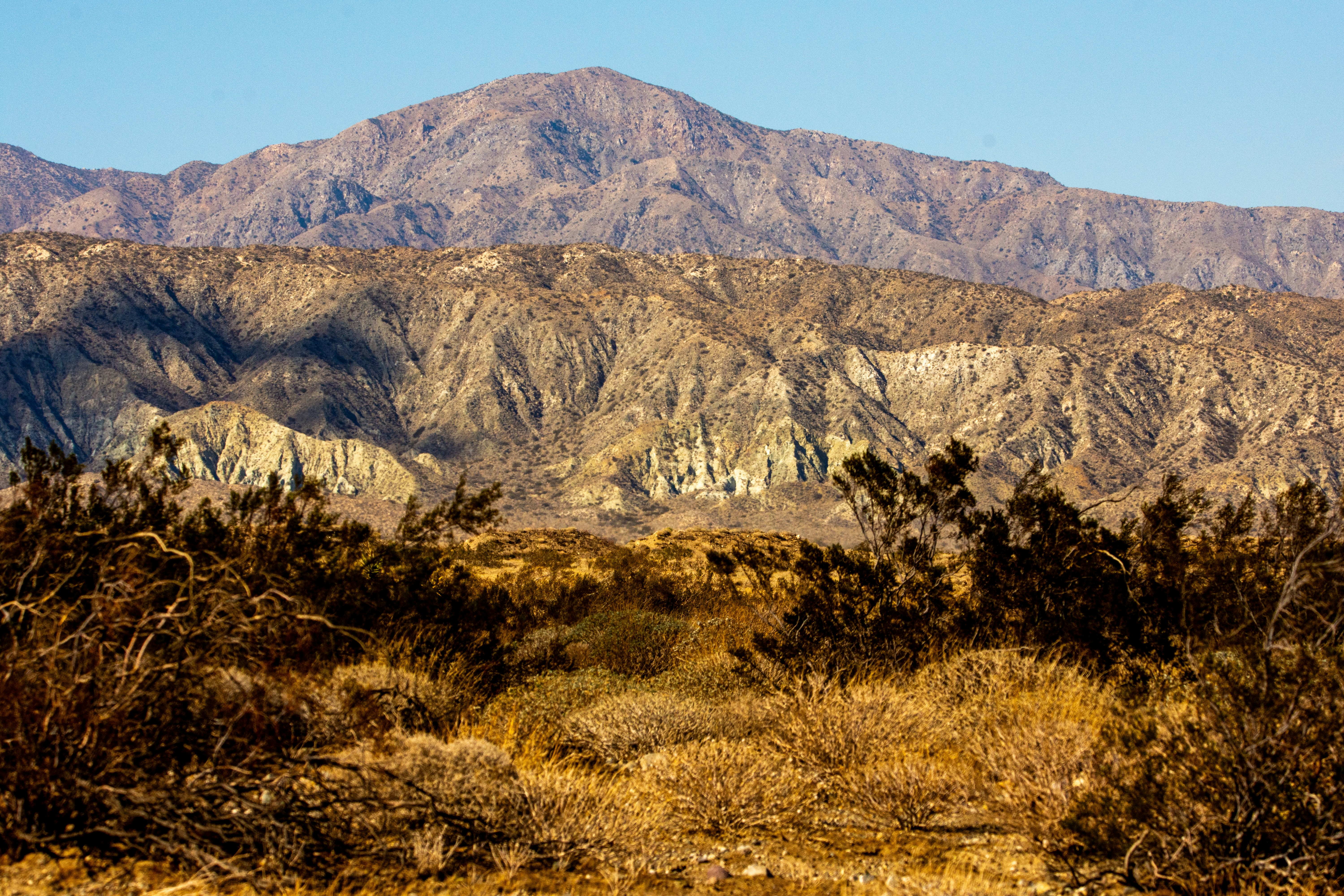 Desert Echoes: A Basin Between Rugged Hills