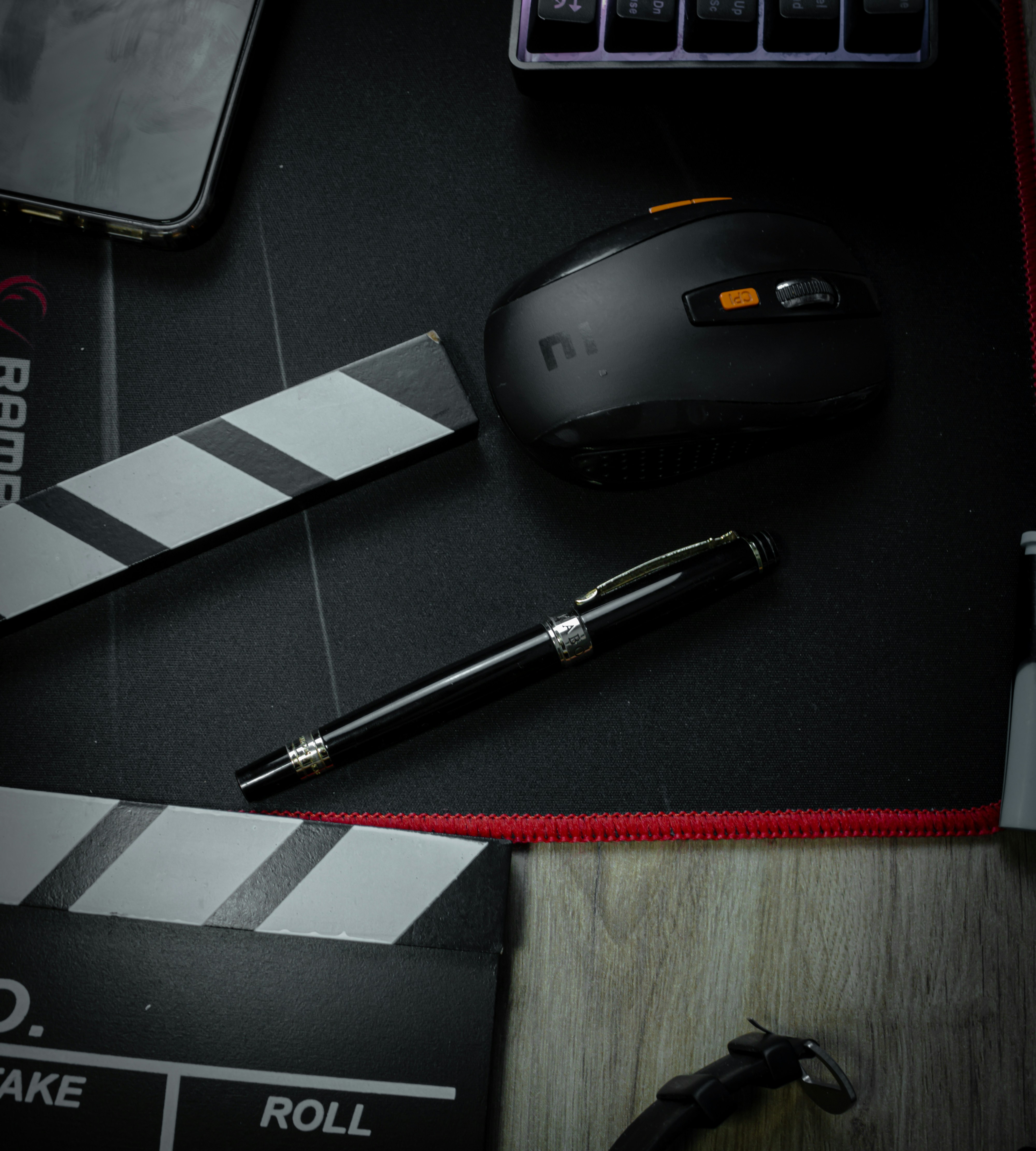Desk Clapperboard and Tools: A Studio Desk with Mouse and Pen