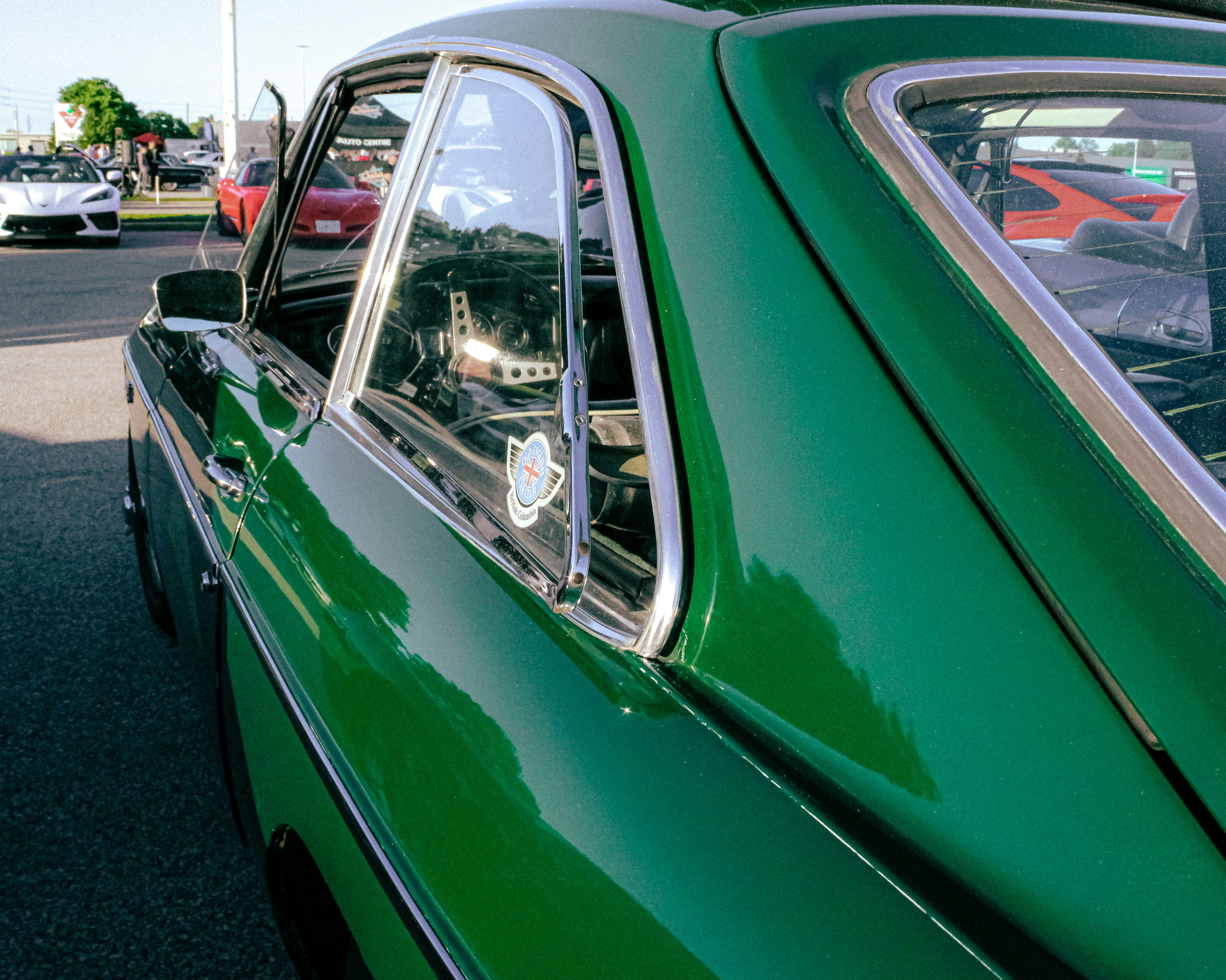 Emerald Classic: Close-Up on a Vintage Green Car Window