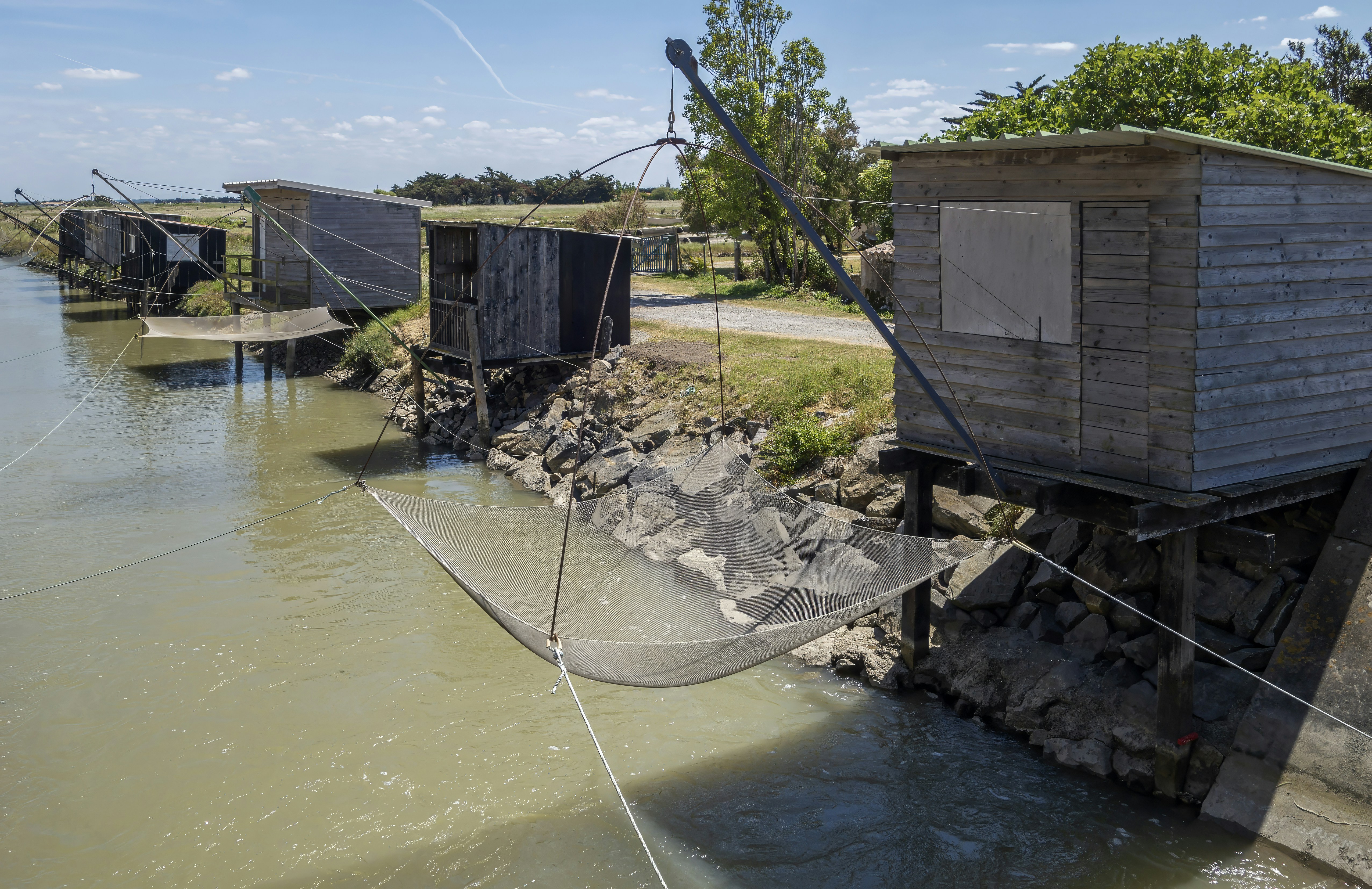 Net-floe At the Ready: A Row of Shuttered Docks Over Calm Tides