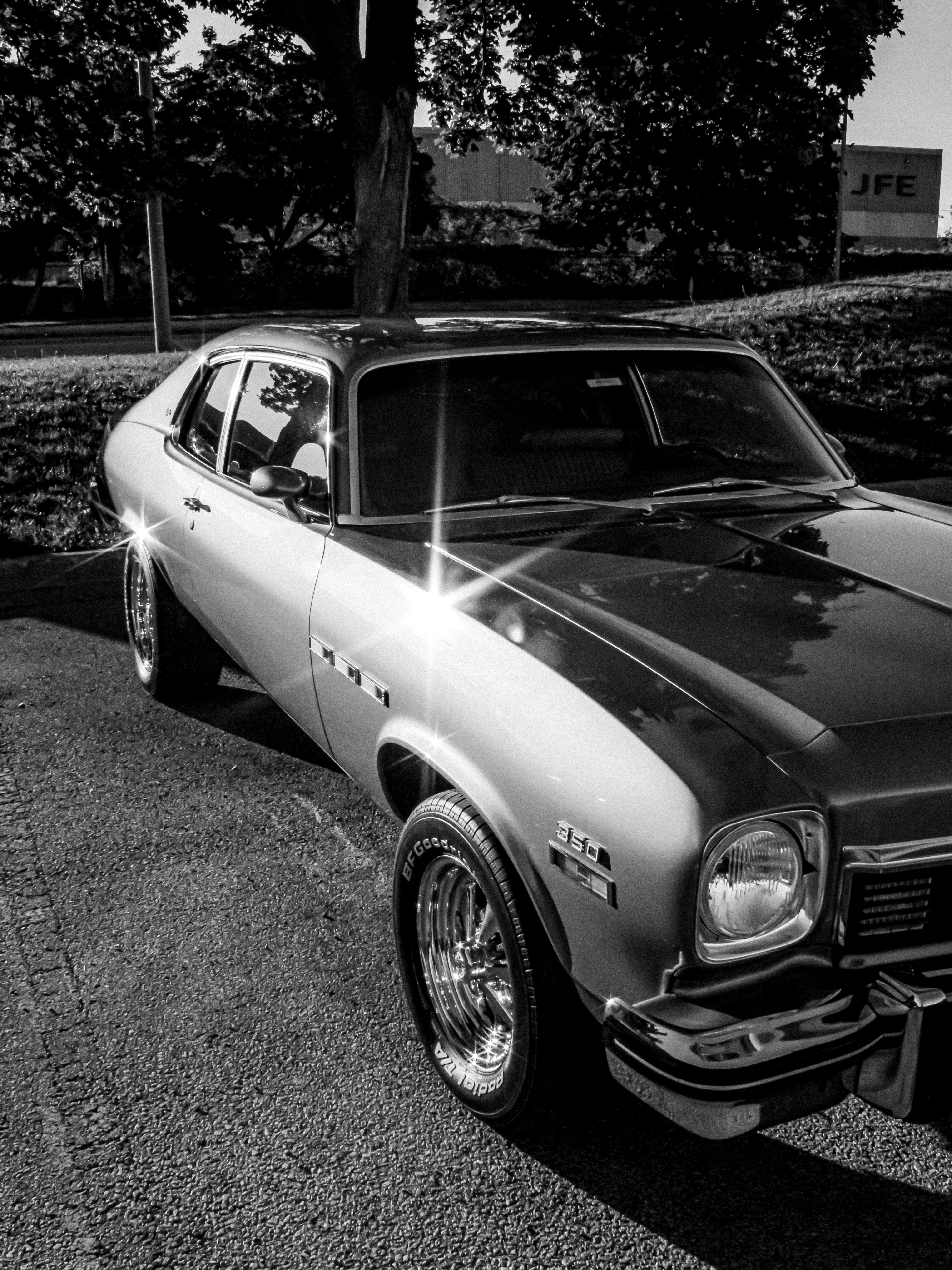 Chrome-lined Nostalgia: A Classic Mopar Basked in Sunlit Gloss