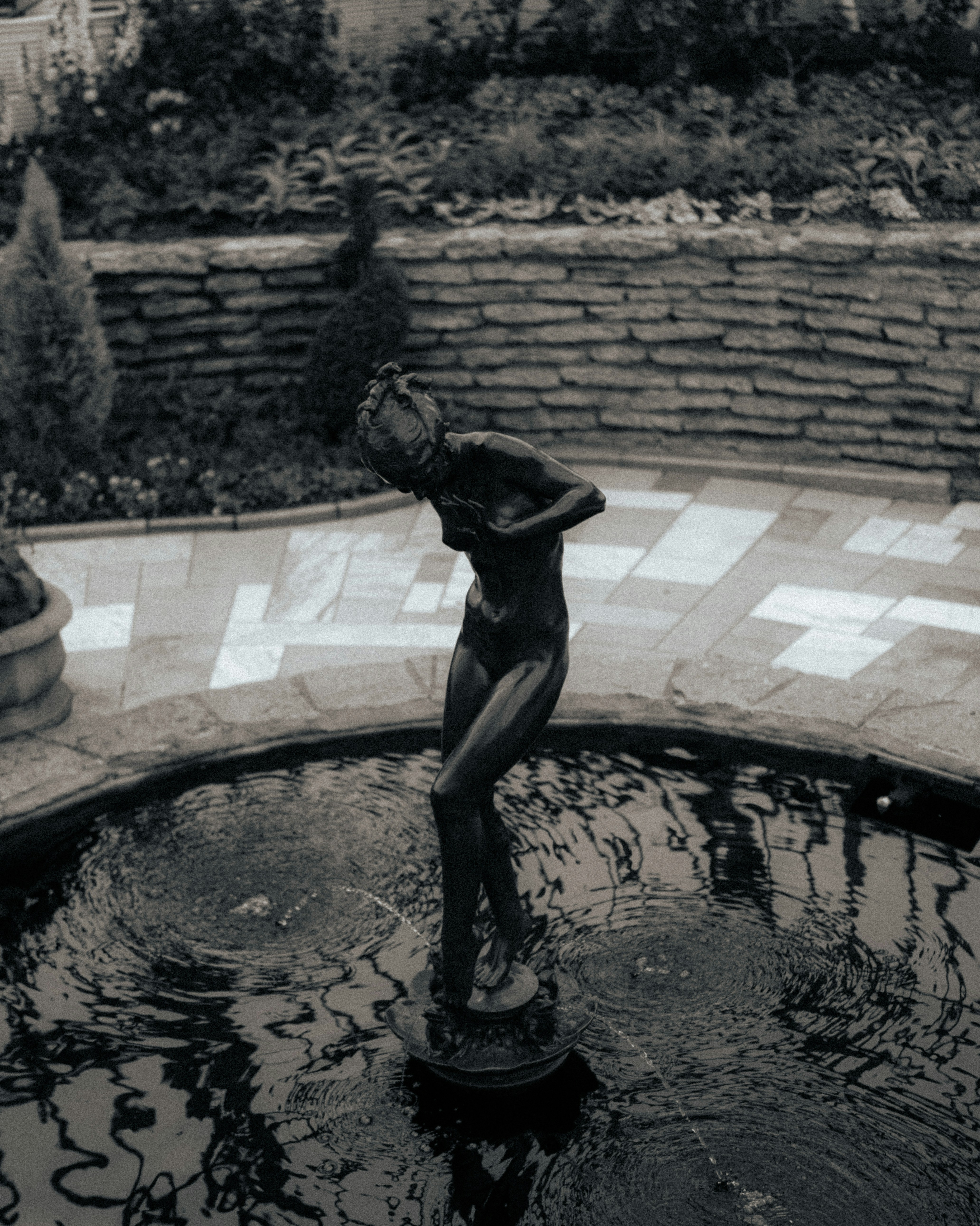 Shrouded Fountain Statue: A Quiet Moment in the Garden