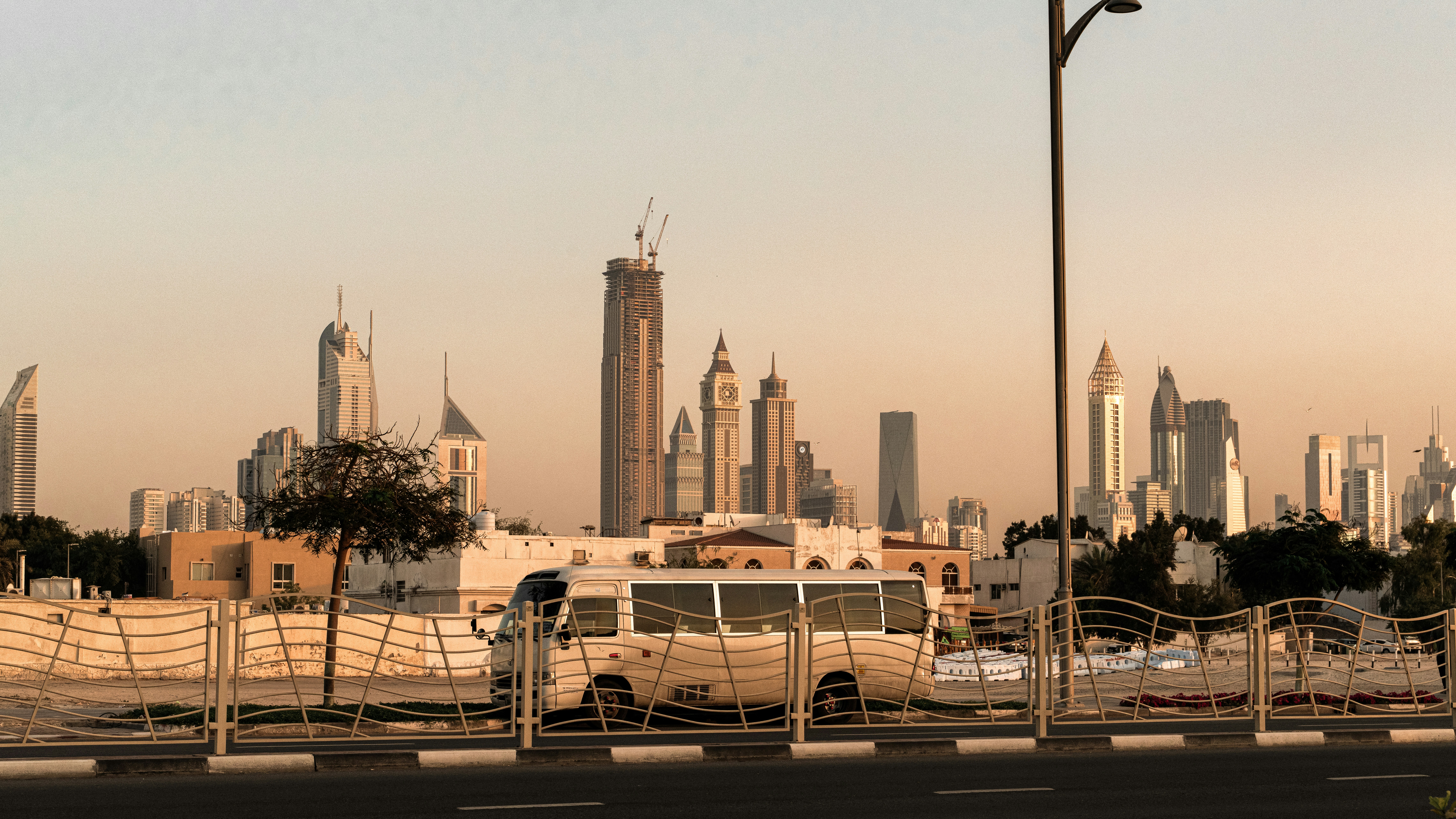 Cityscape on the Waterfront: Towers Rise Beyond the Road
