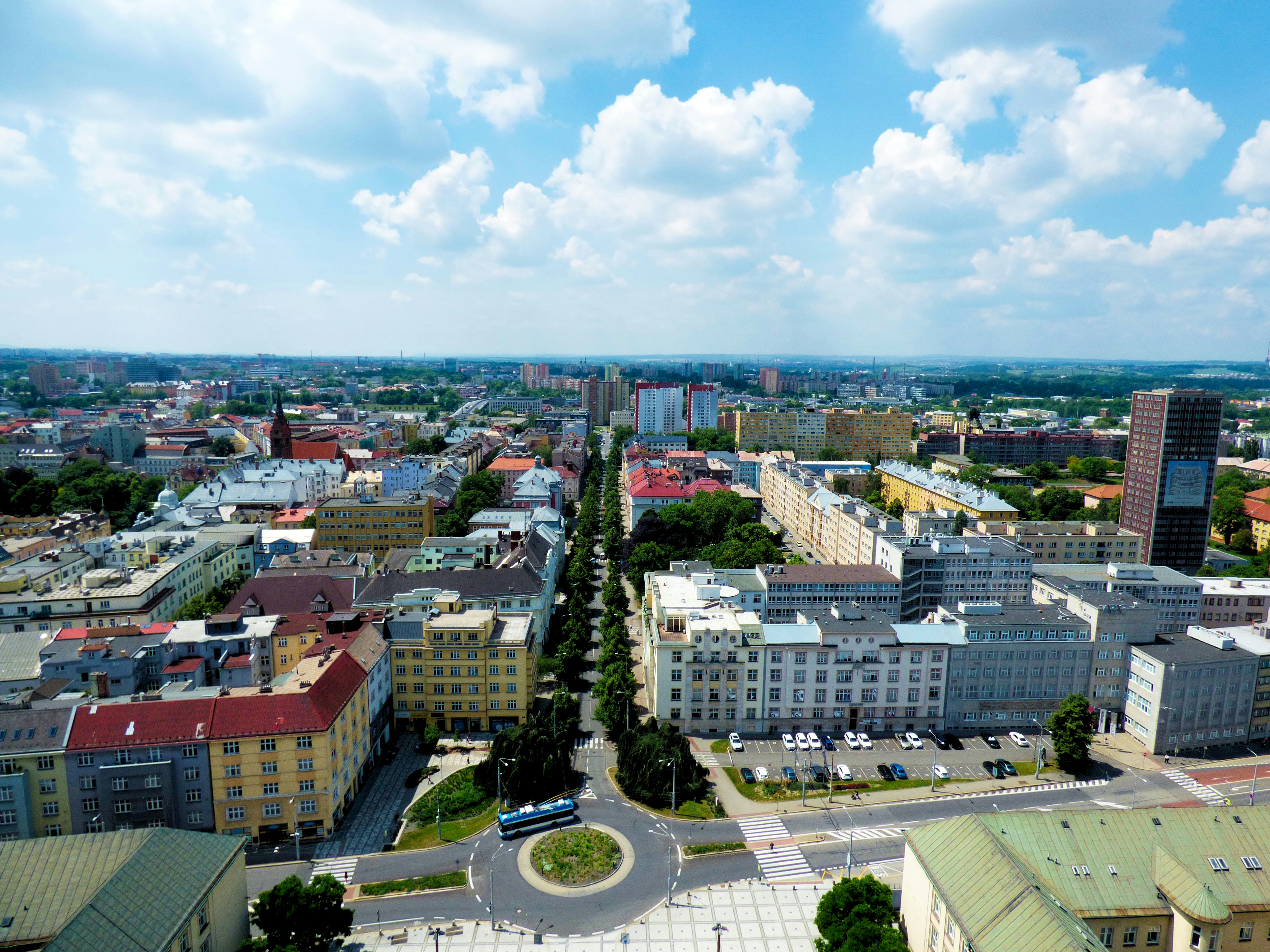 Aerial Tapestry: City Grid Unfolding Under a Bright Sky