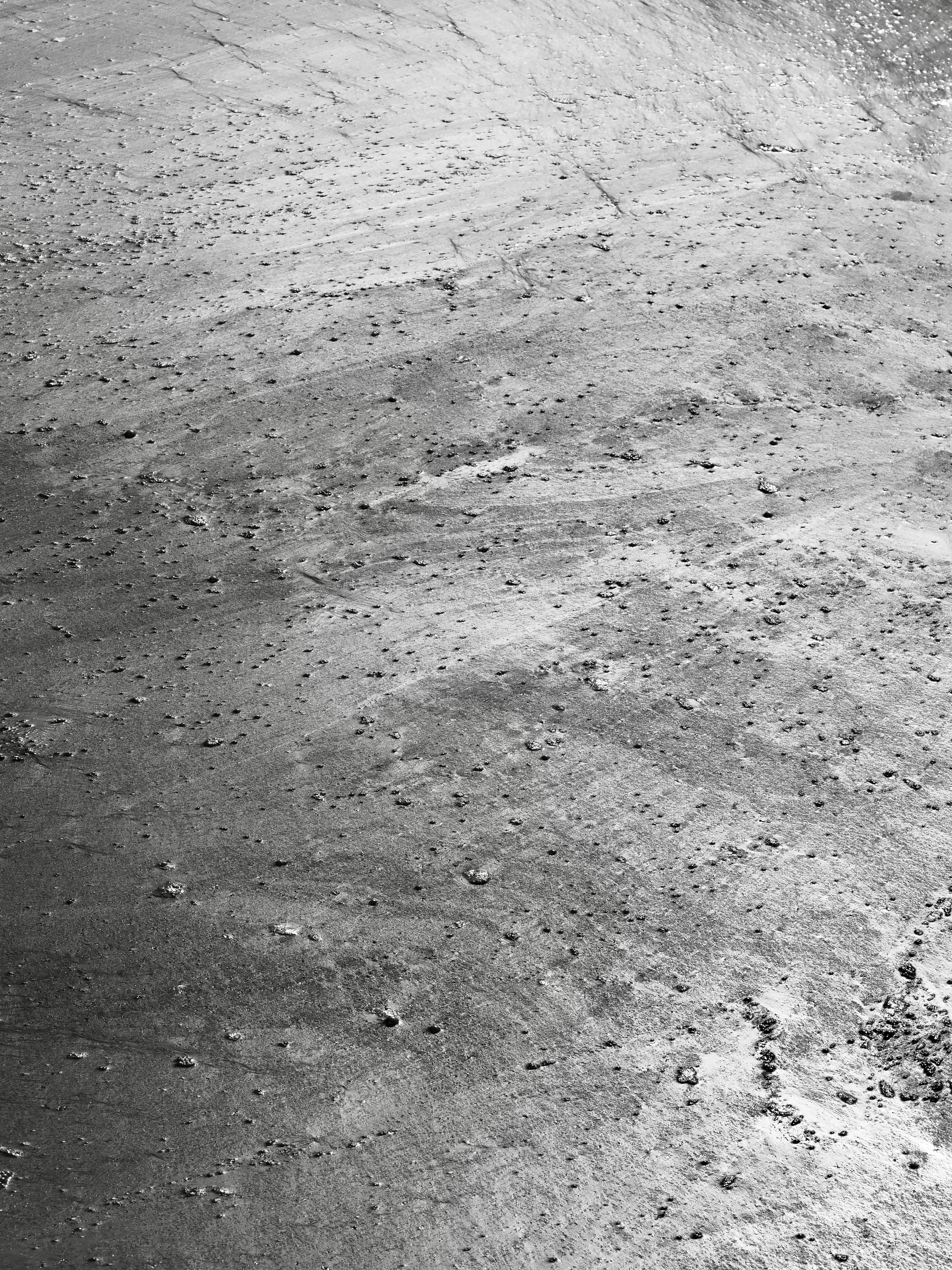 Dusty Traces: A Quiet Sweep Across a Monochrome Slope