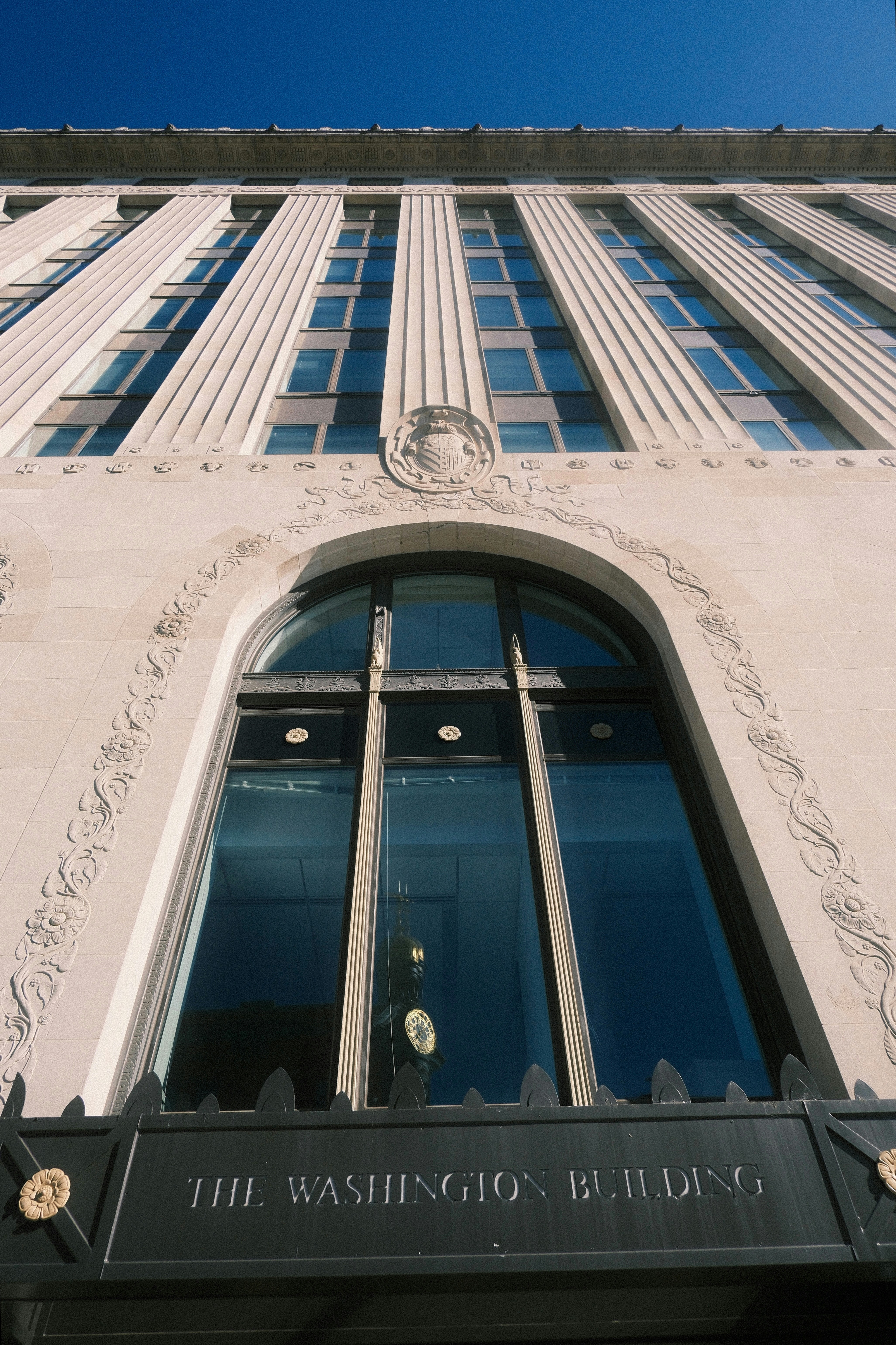 Archway of The Washington Building: Vertical Symmetry and Gate of Glass