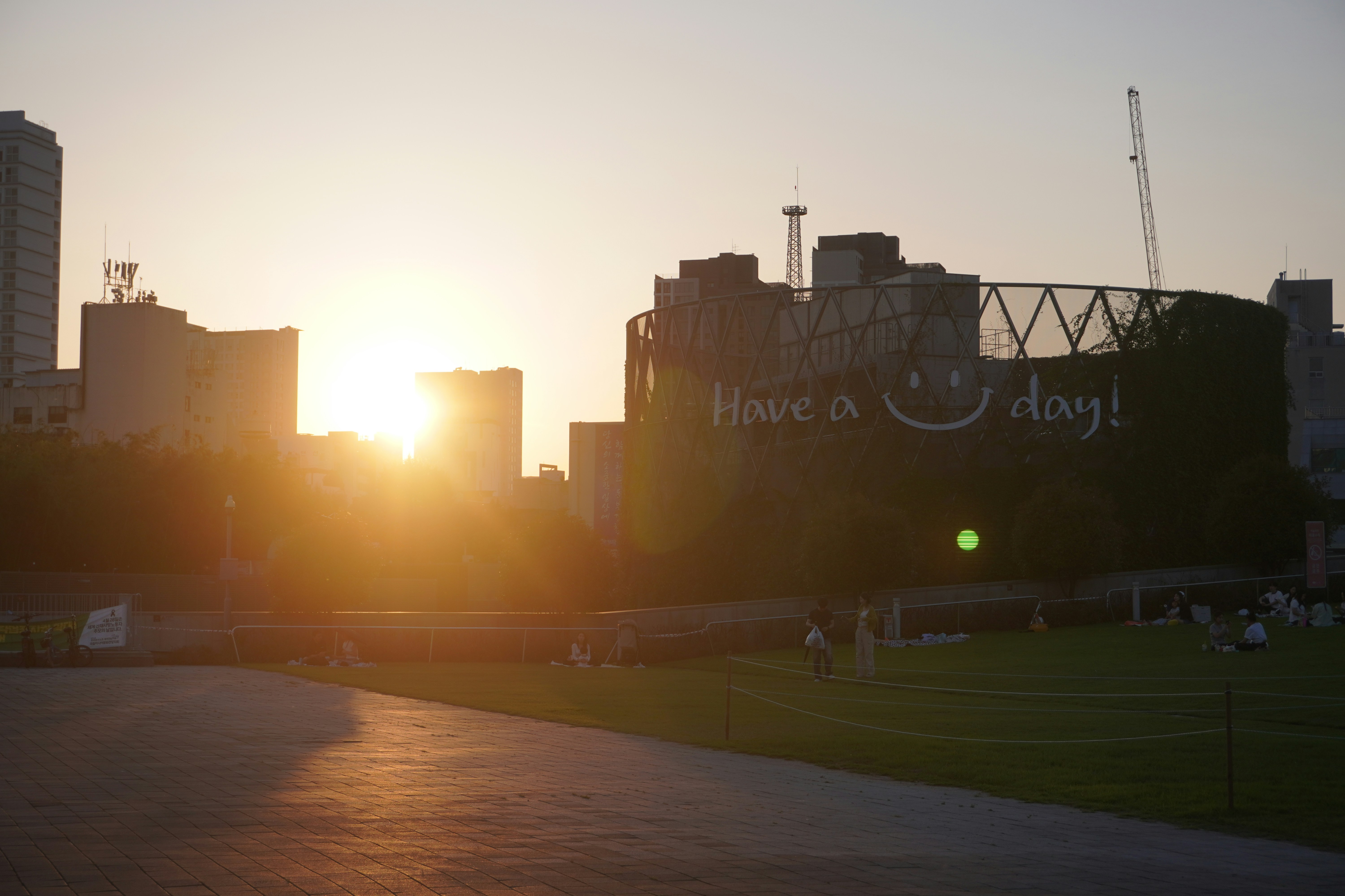 Sunset Over the City Playground with a Smile Wall