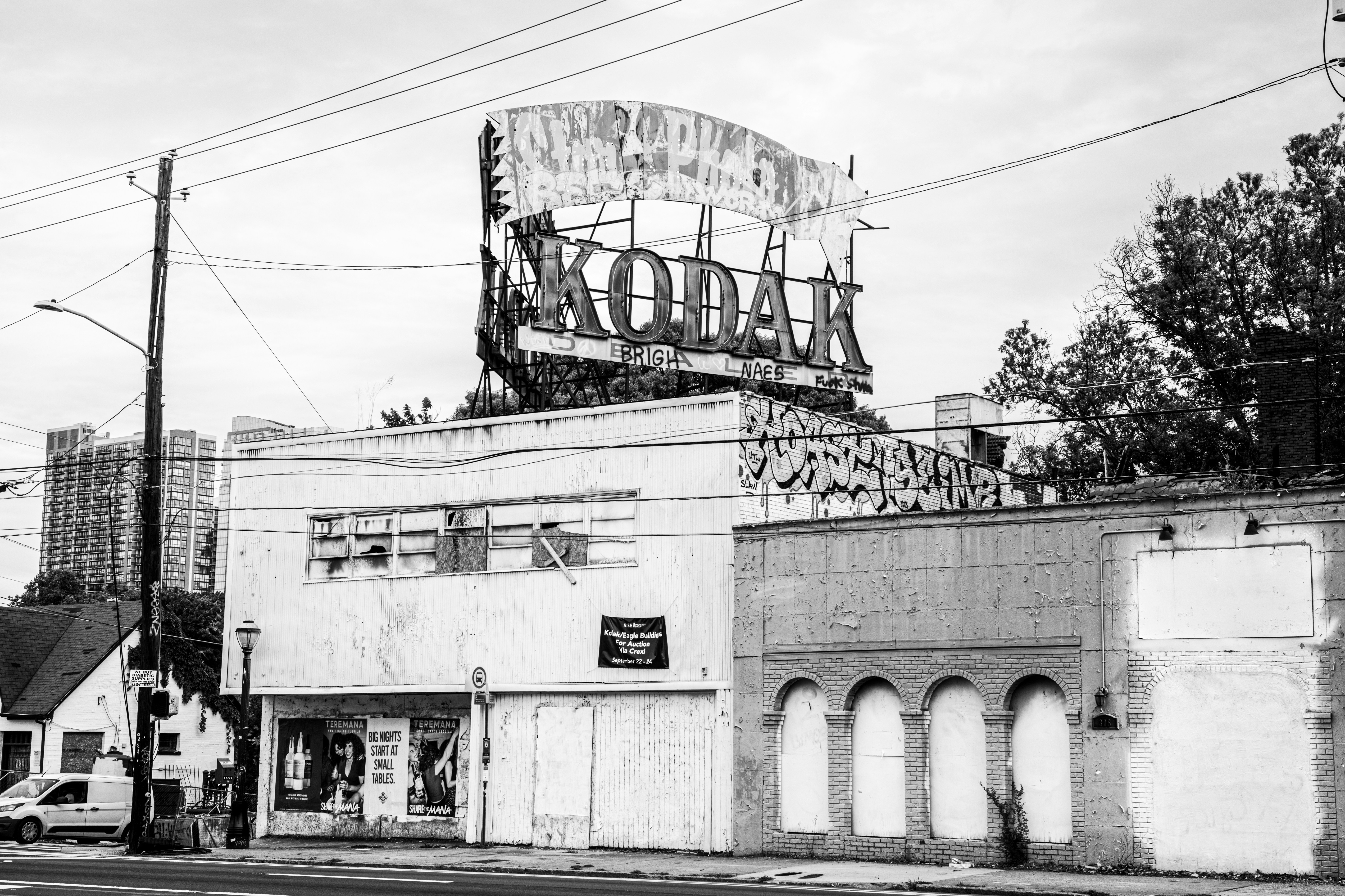 Rotten Neon: The KODAK Sign Over a Weathered Street