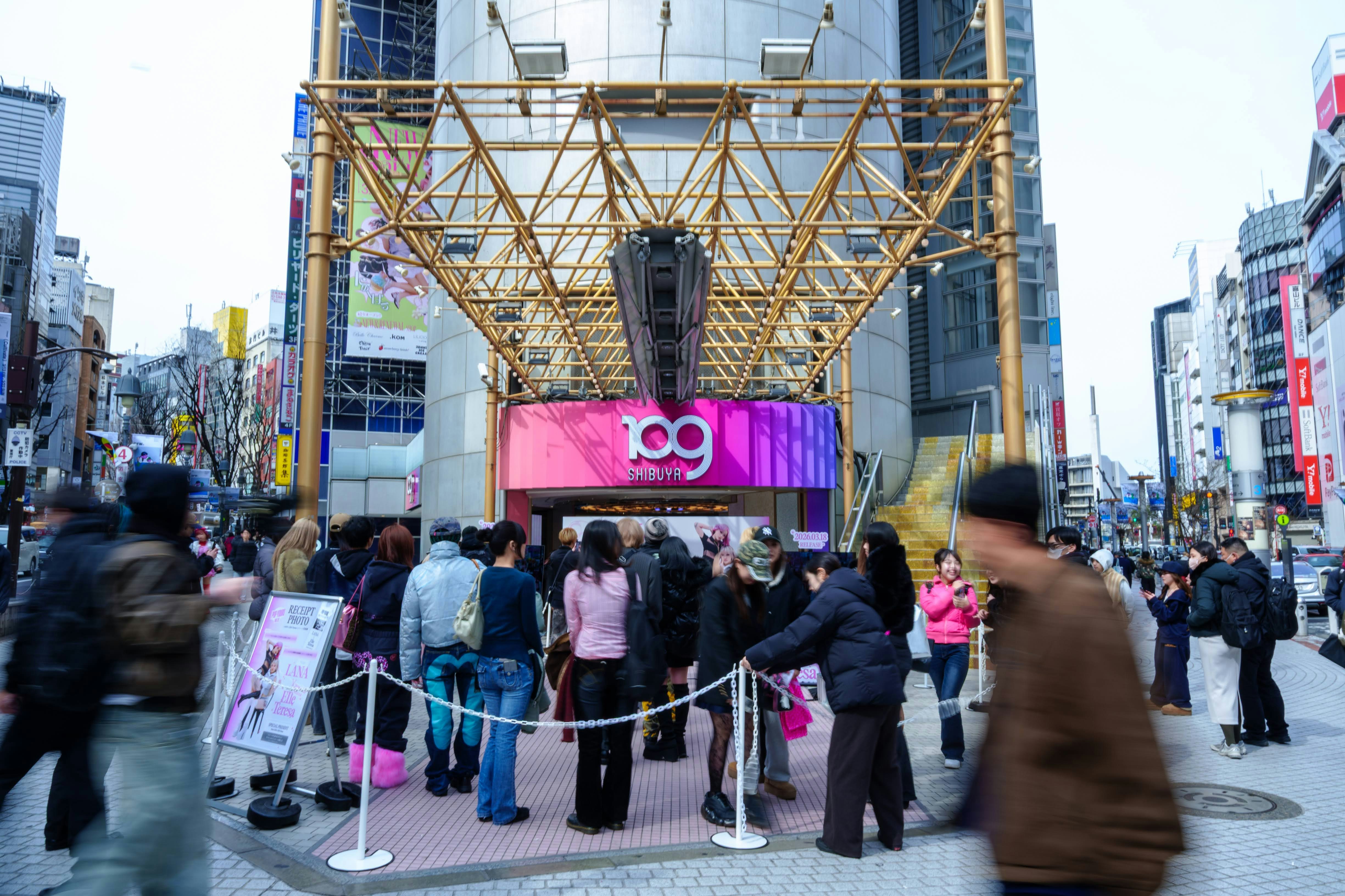People gather outside the iconic shibuya 109 building.