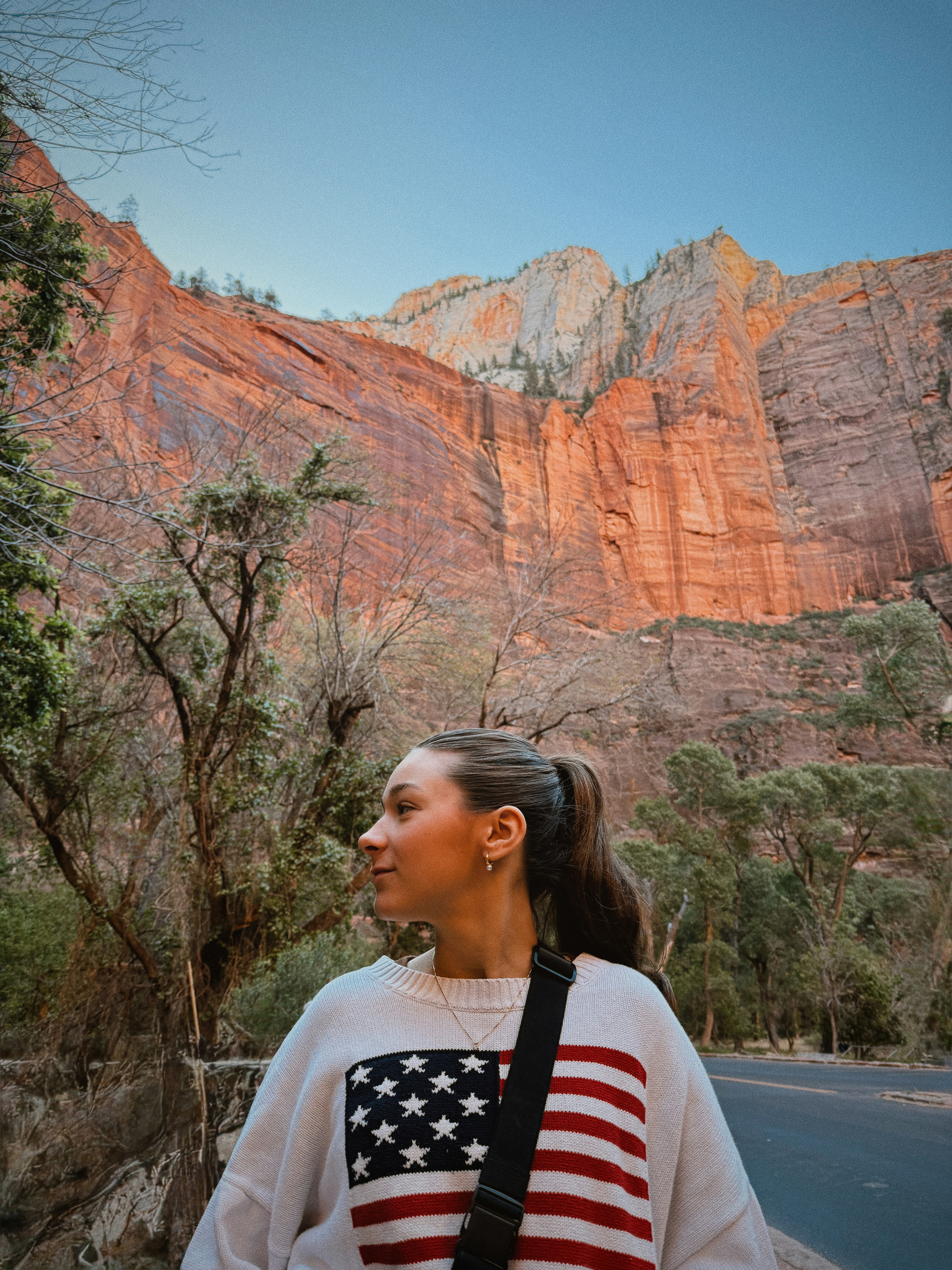 Portrait in a Canyon: Woman in a Swept-Back Ponytail Against Red Cliff
