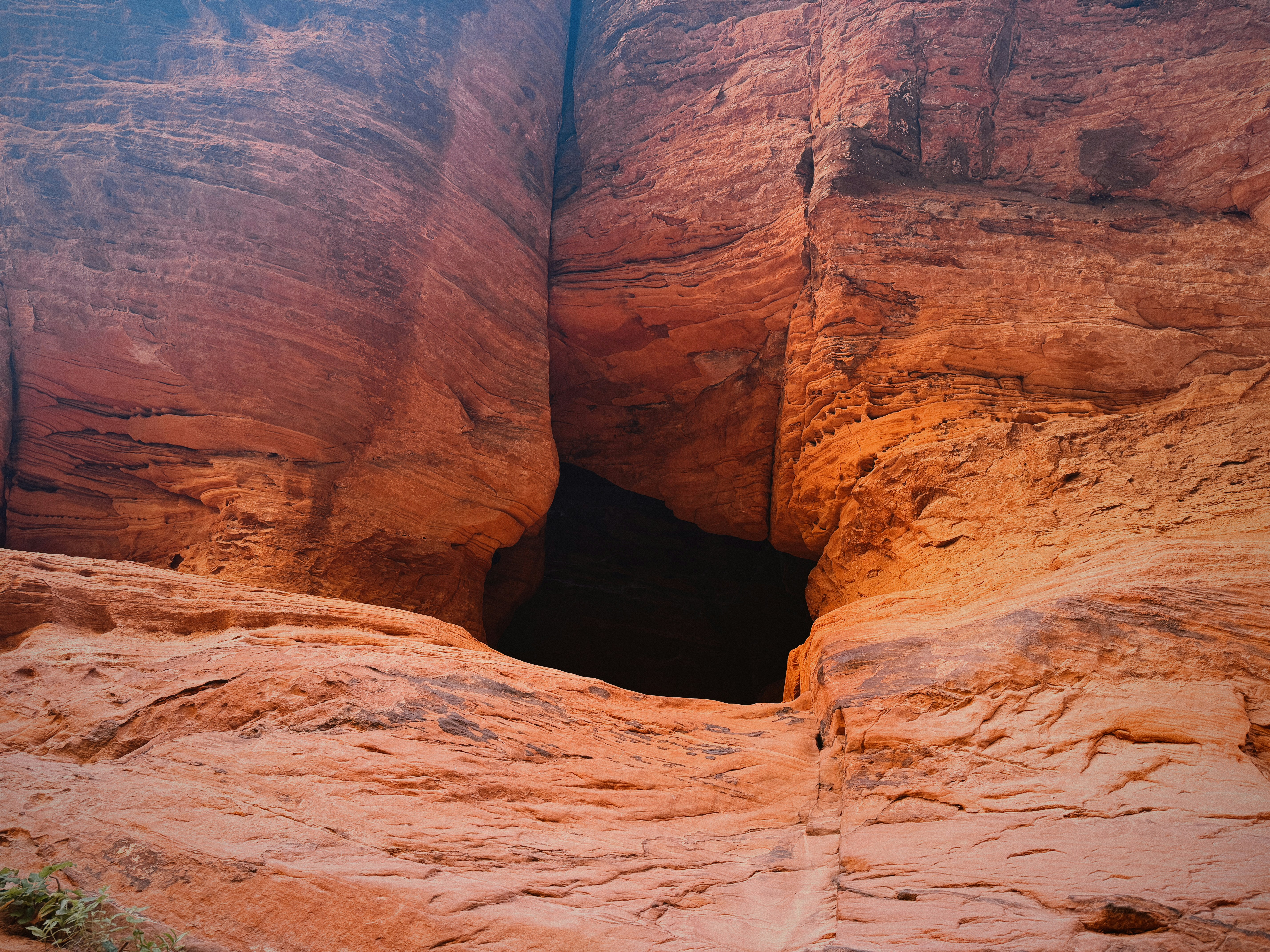Cinder Canyon: A Dark Crevice in Carved sandstone