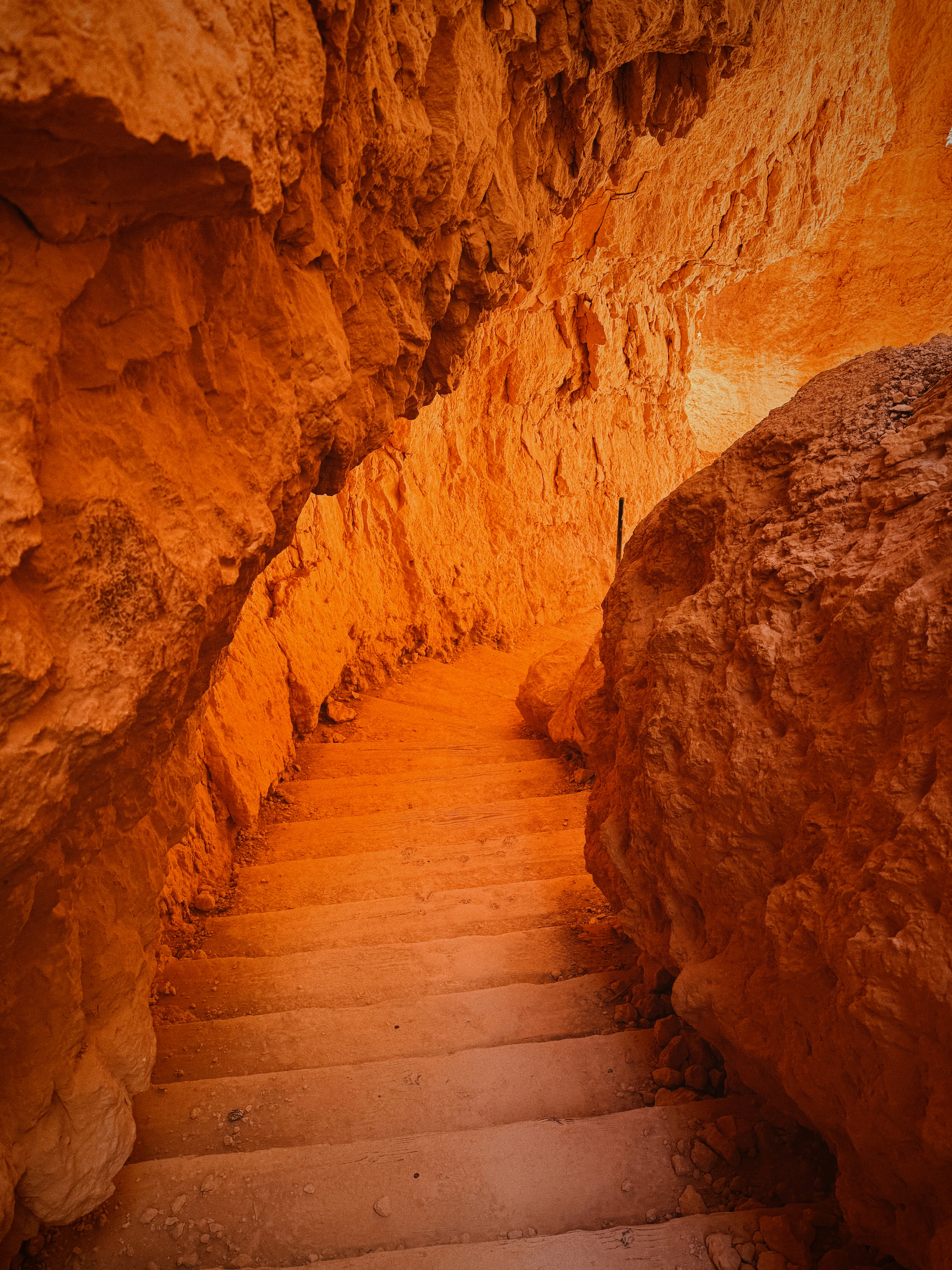 Crimson Canyon Stairway: A Narrow Passage Through Glowing Cliffs