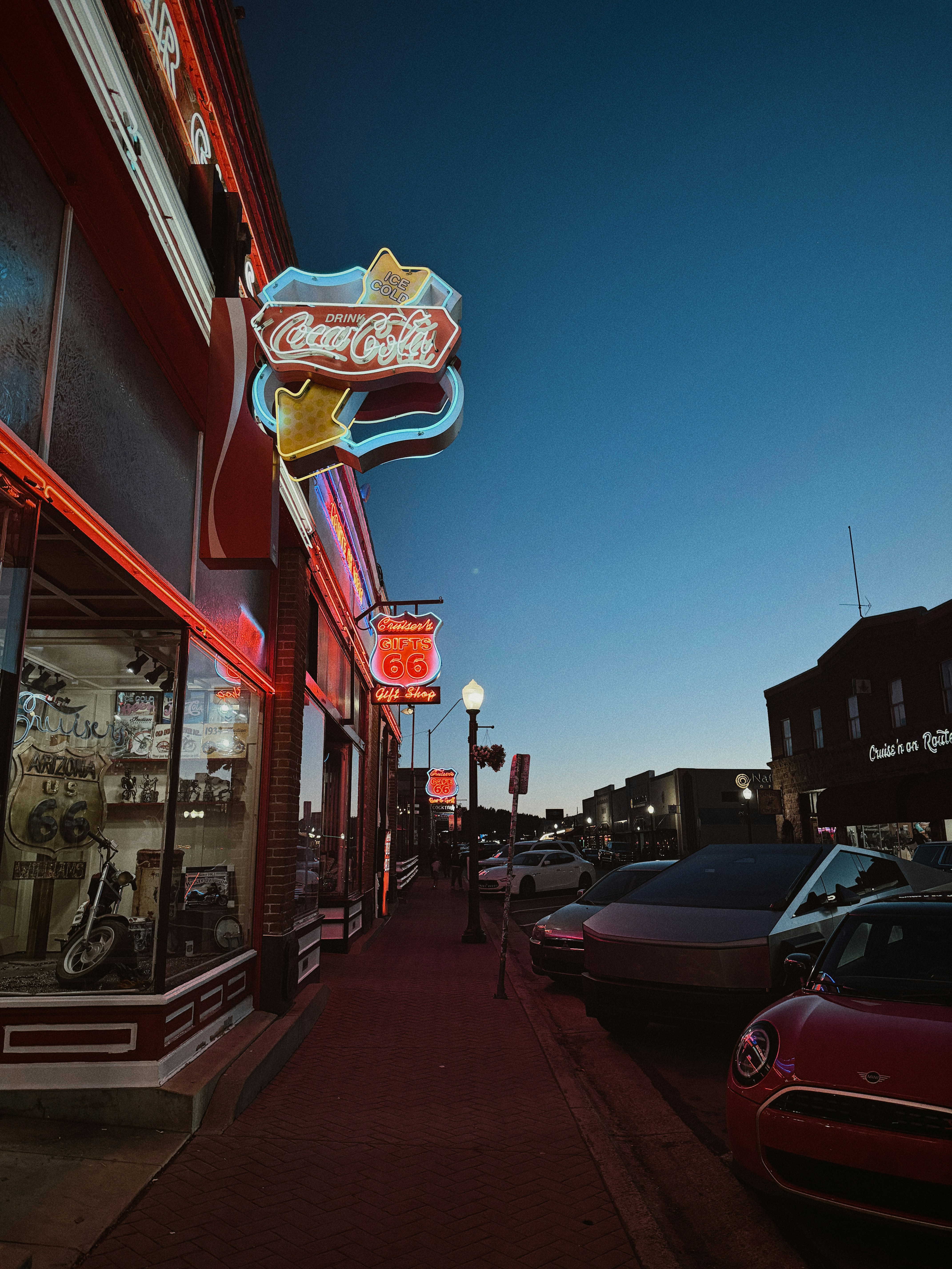 Neon Route: A Retro Main Street Under a Dusk Blue Sky