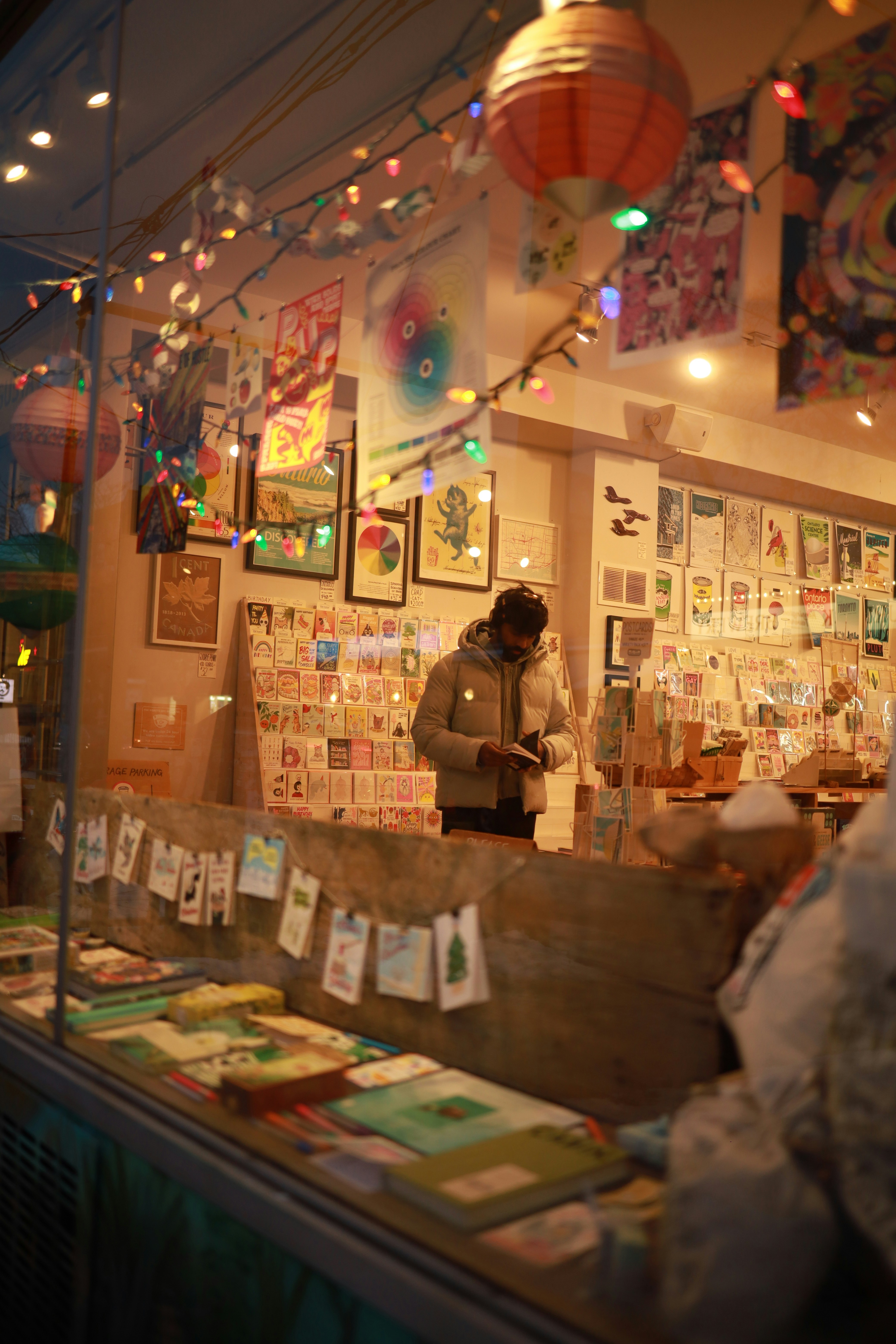 Moonlit Bookshop Glow: A Shopper in Warm Gallery Light