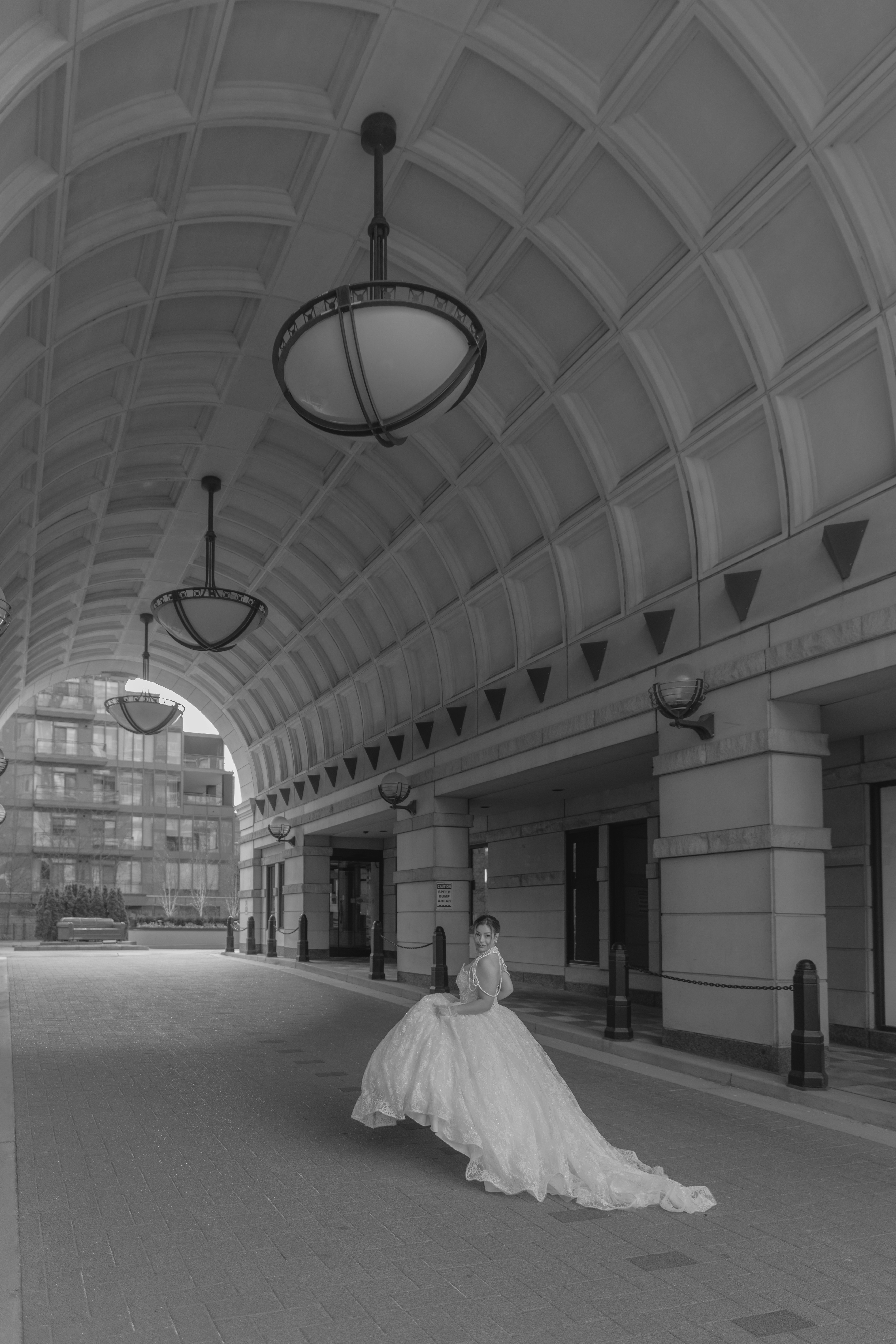 A Gown in the Archway: Bridal Silhouette Under the Arching Ceiling